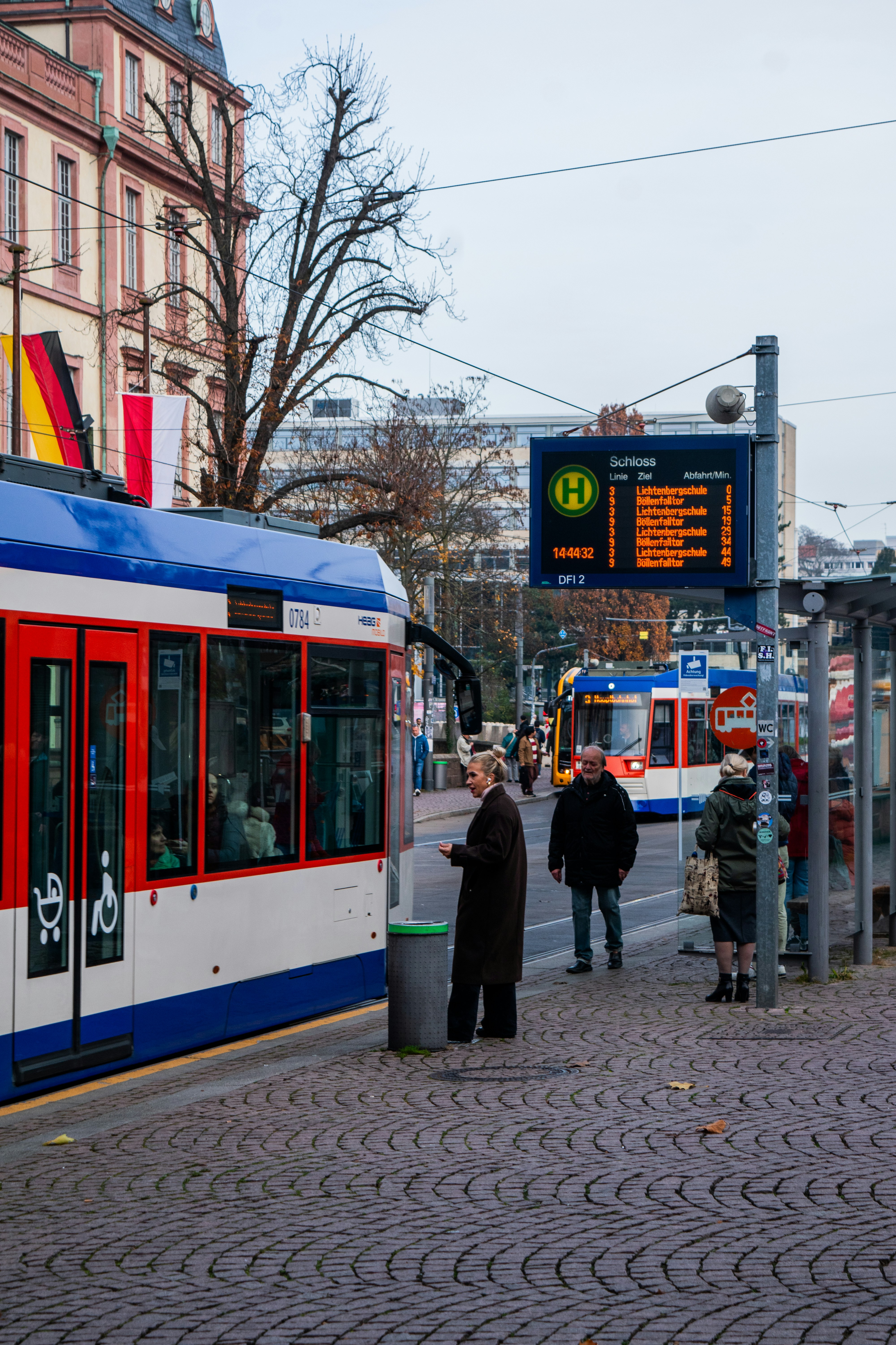 Trams at Dusk: Digital Signage Illuminates a Cobblestone Platform