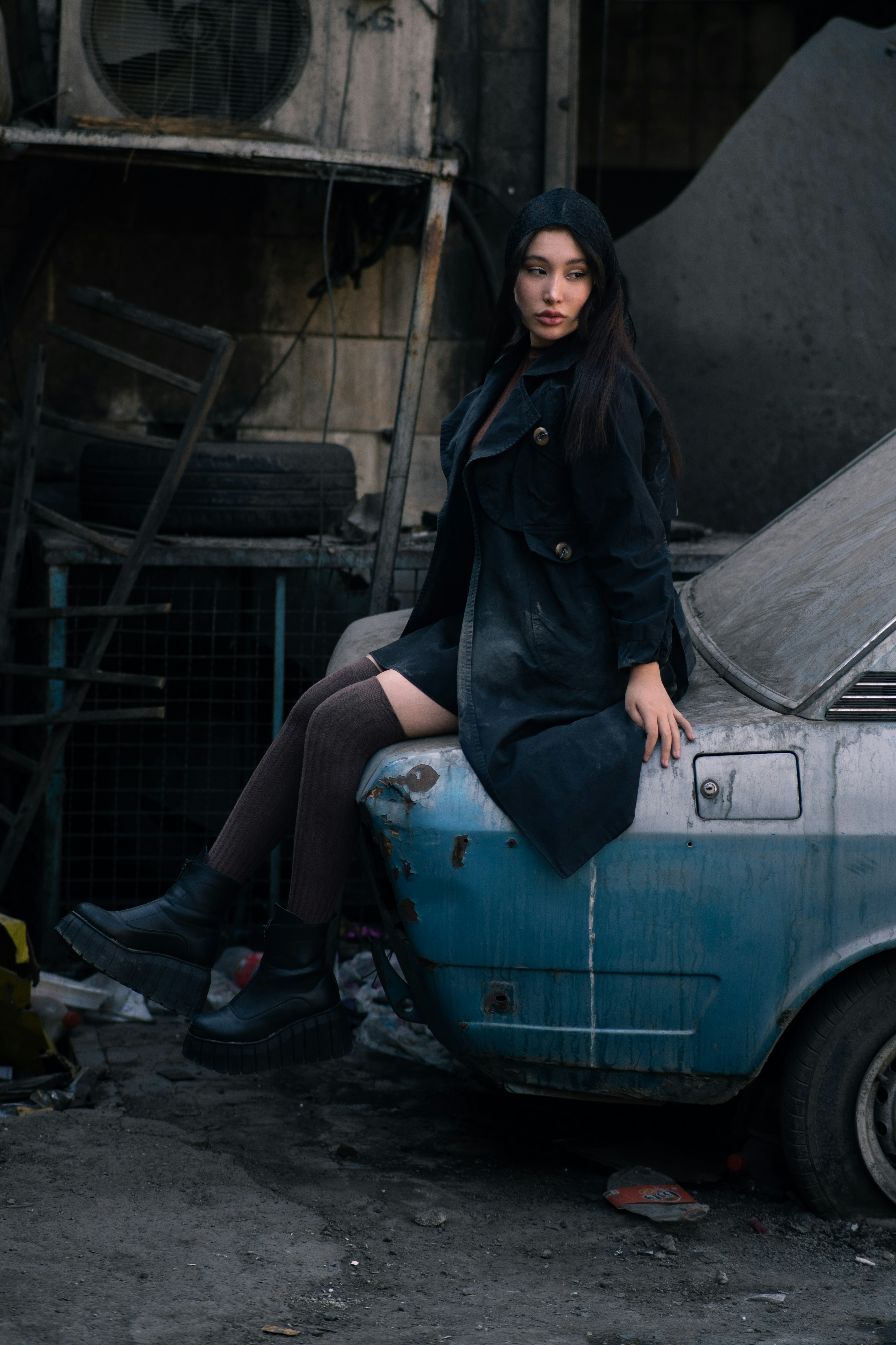 Rust-Blue Quiet: A Portrait on a Weathered Sedan in a Desolate Yard