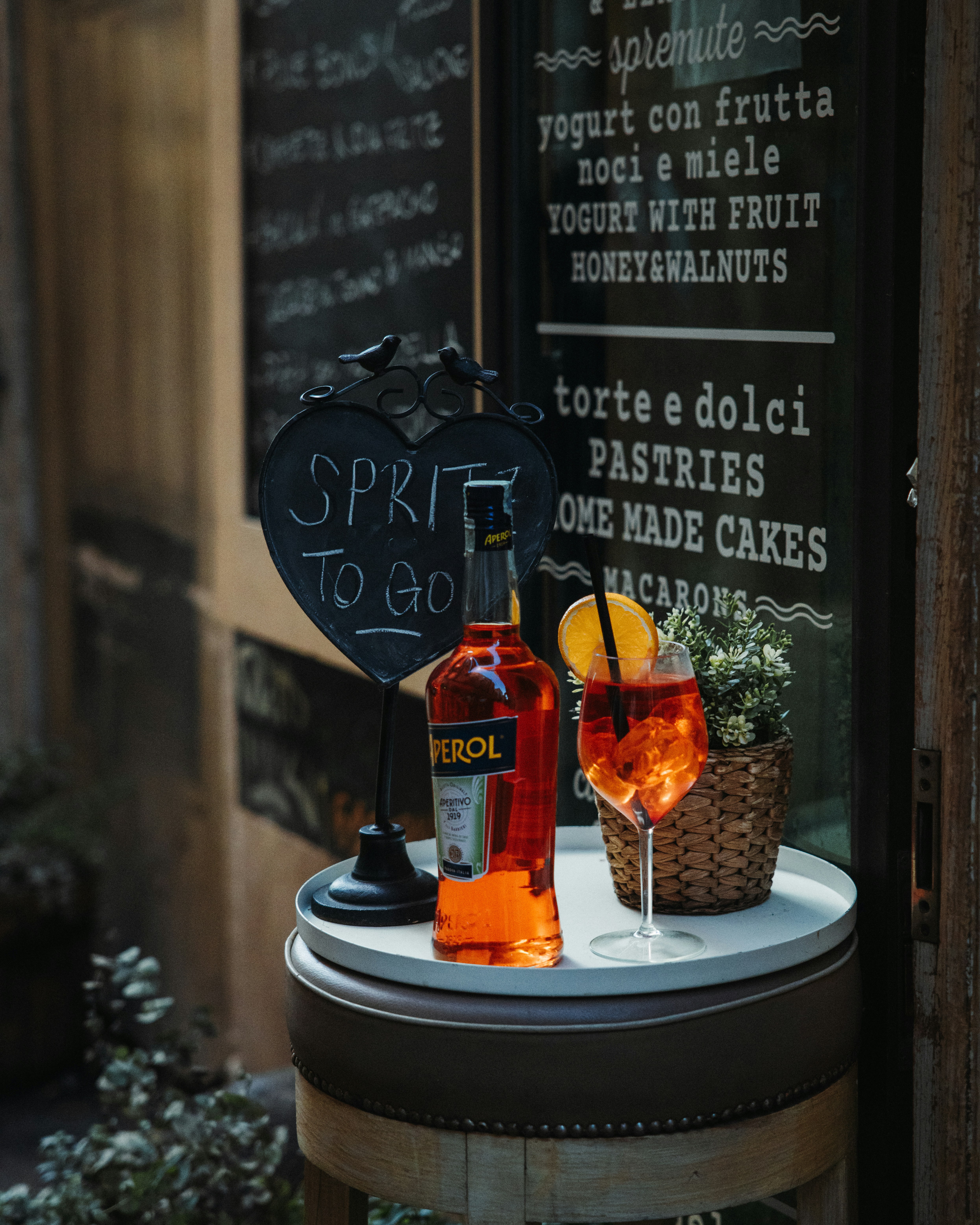 Amber Aperitif on a Chalkboard-Backed Terrace