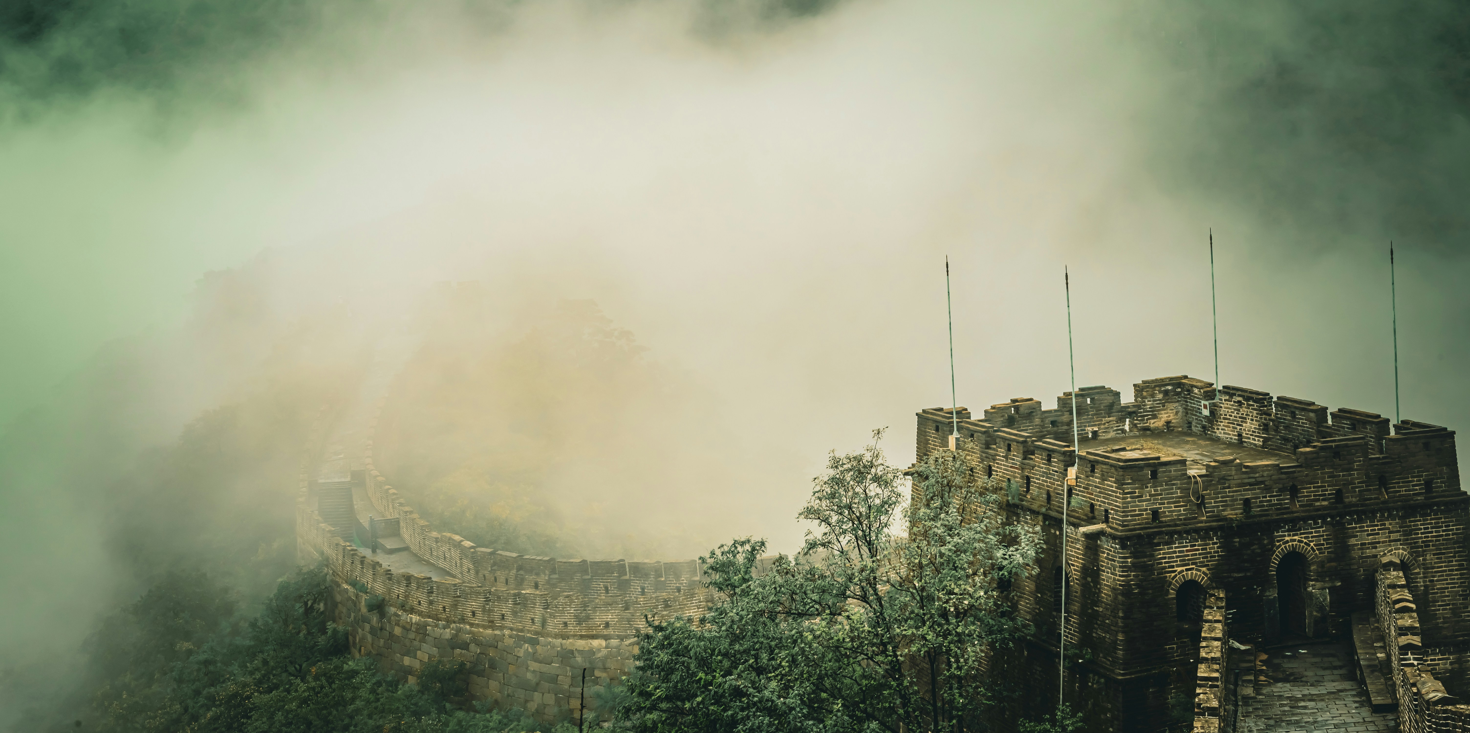 Verdant Mist Clings to a Fortress Wall under Silent Watch