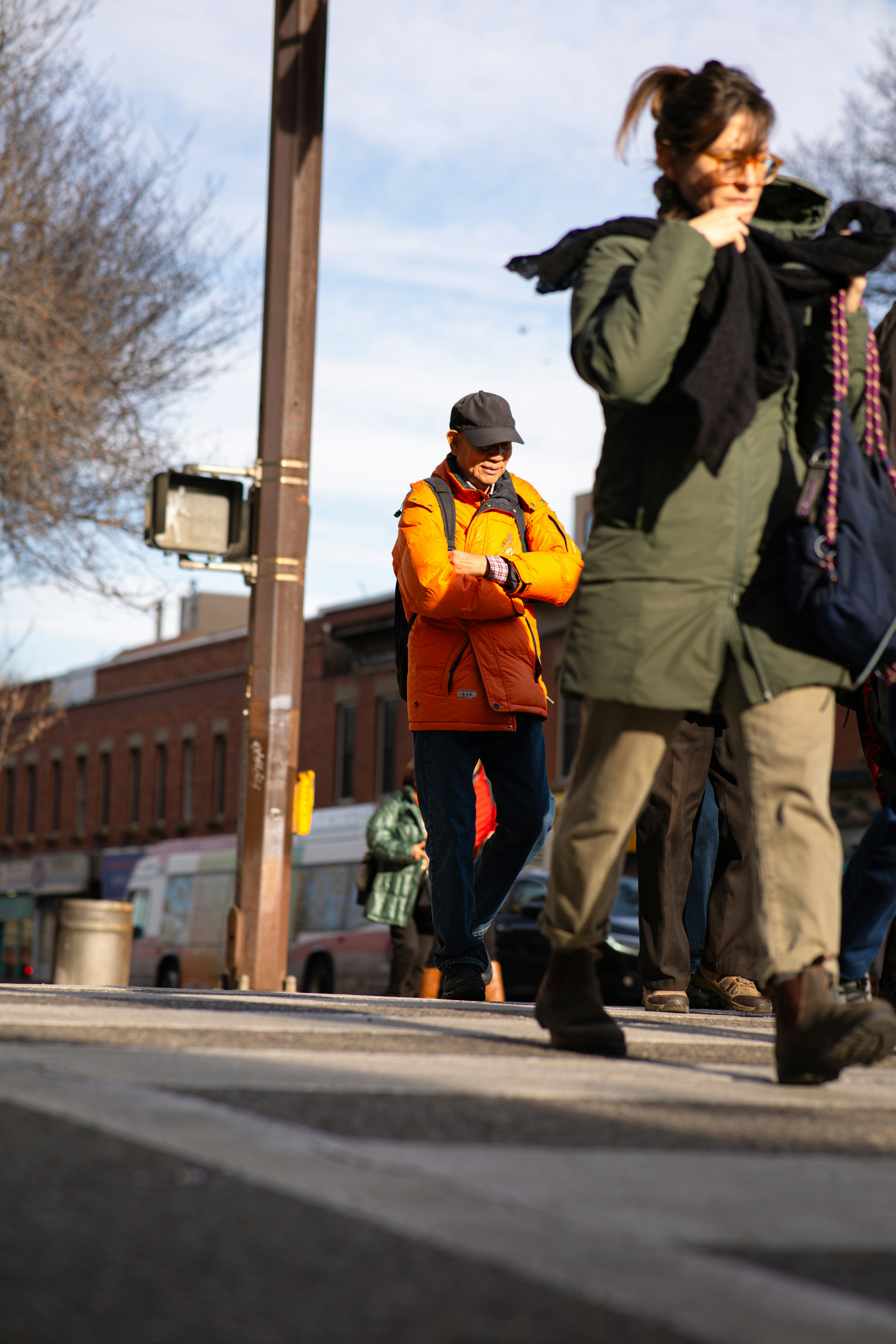 Orange Jacket Sentinel on a City Street