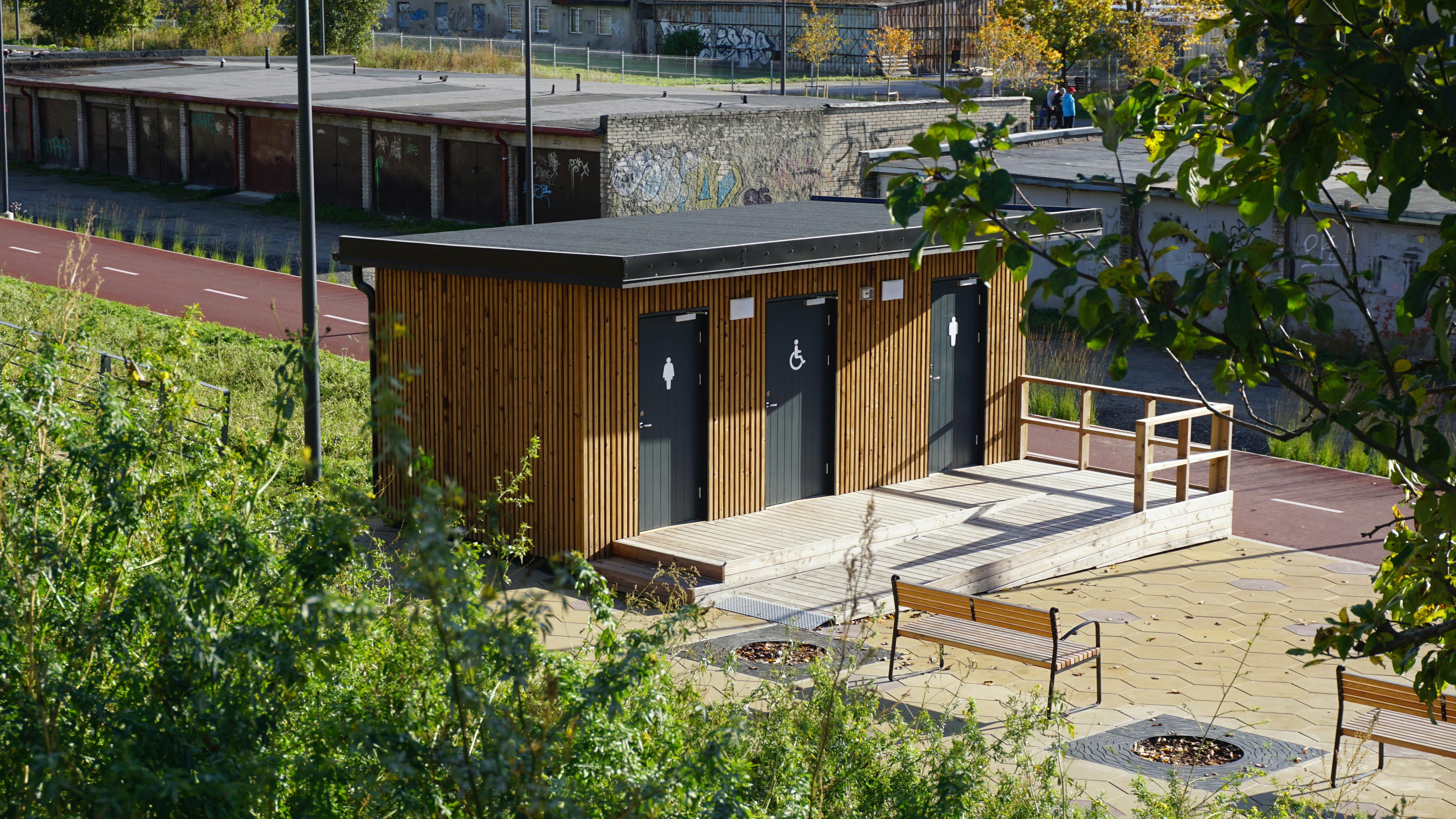Wooden public restroom building with three doors. photo – Free Modern ...