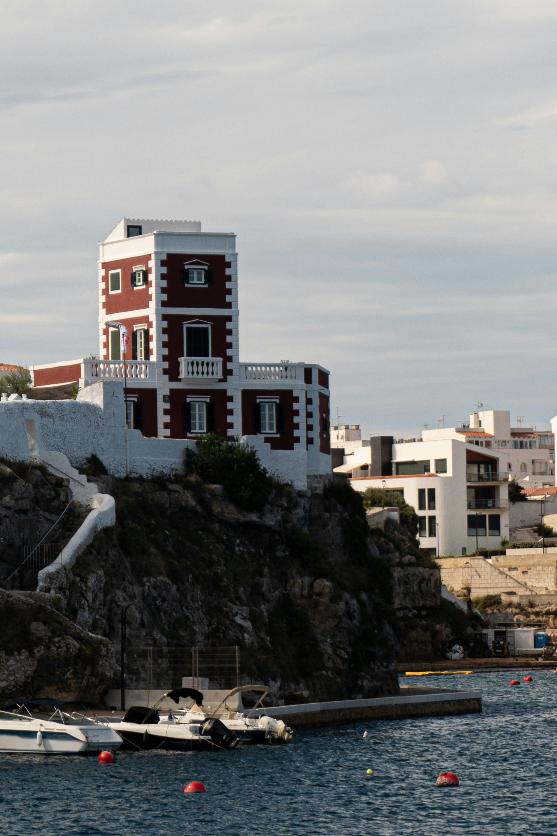 Cliffside Red-Brick Villa Overlooking a Quiet Harbor