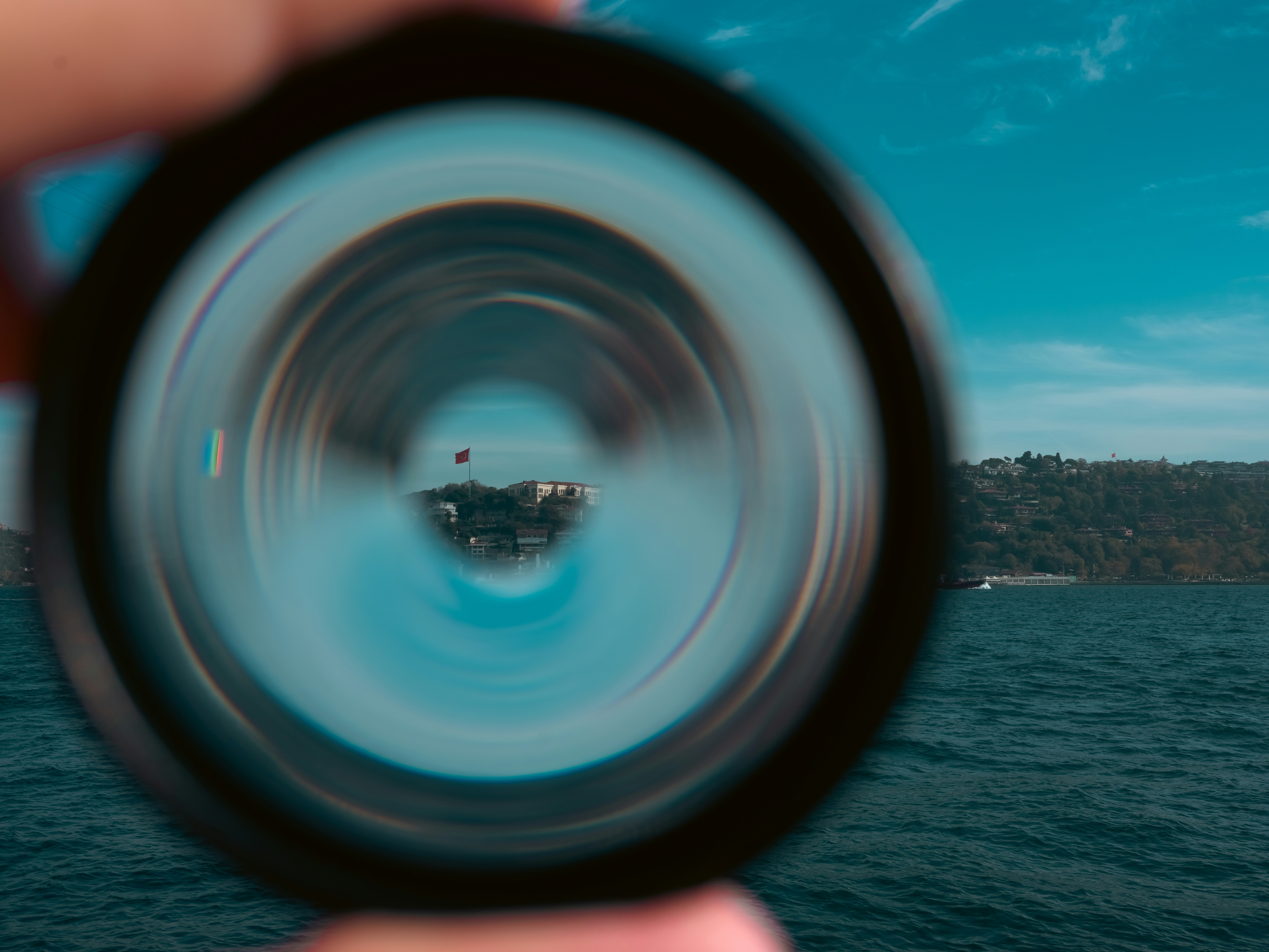 Ringed Horizon: Coastline Framed by a Photographer’s Lens