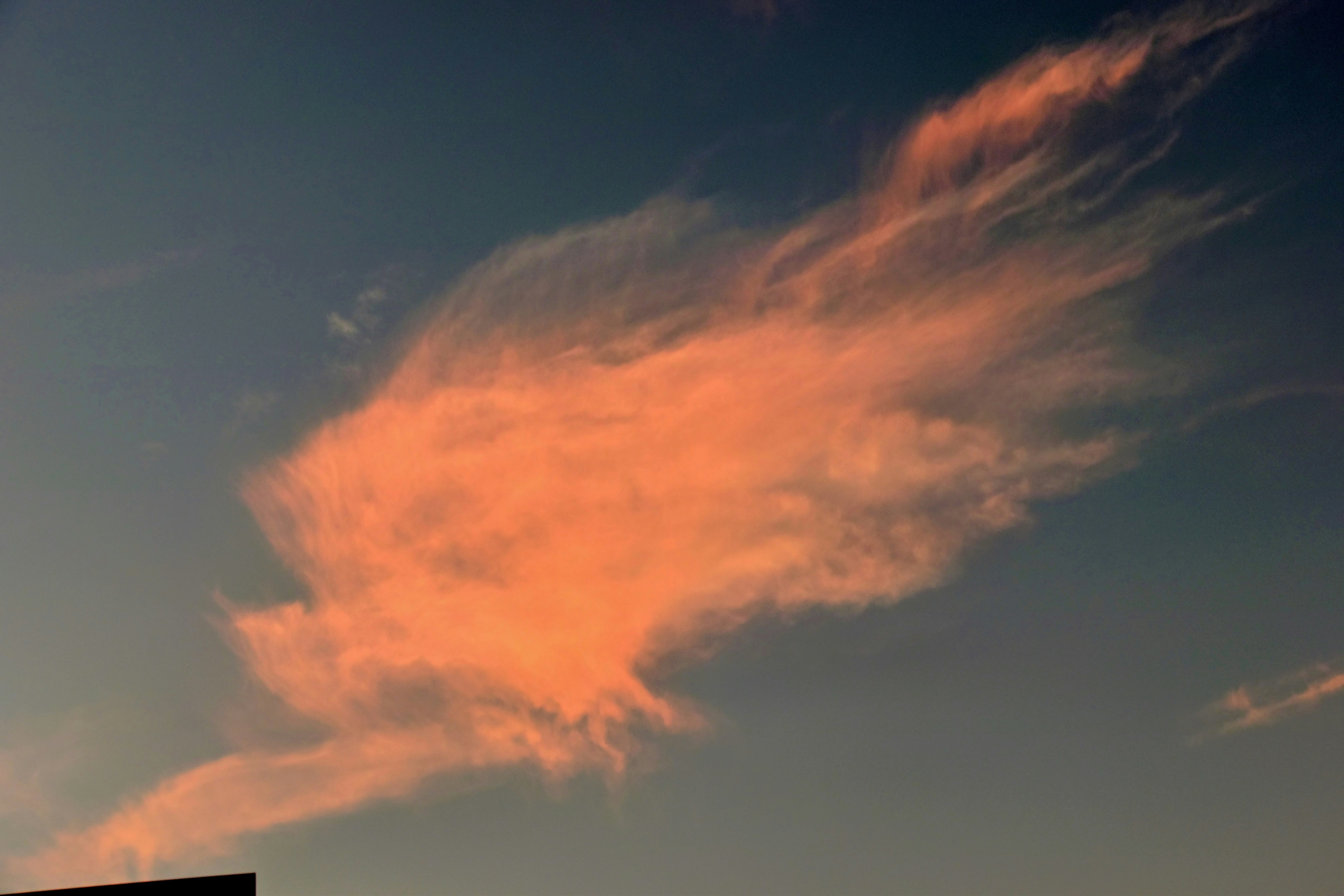 Ember Cloud Drift Across a Quiet Dusk Sky