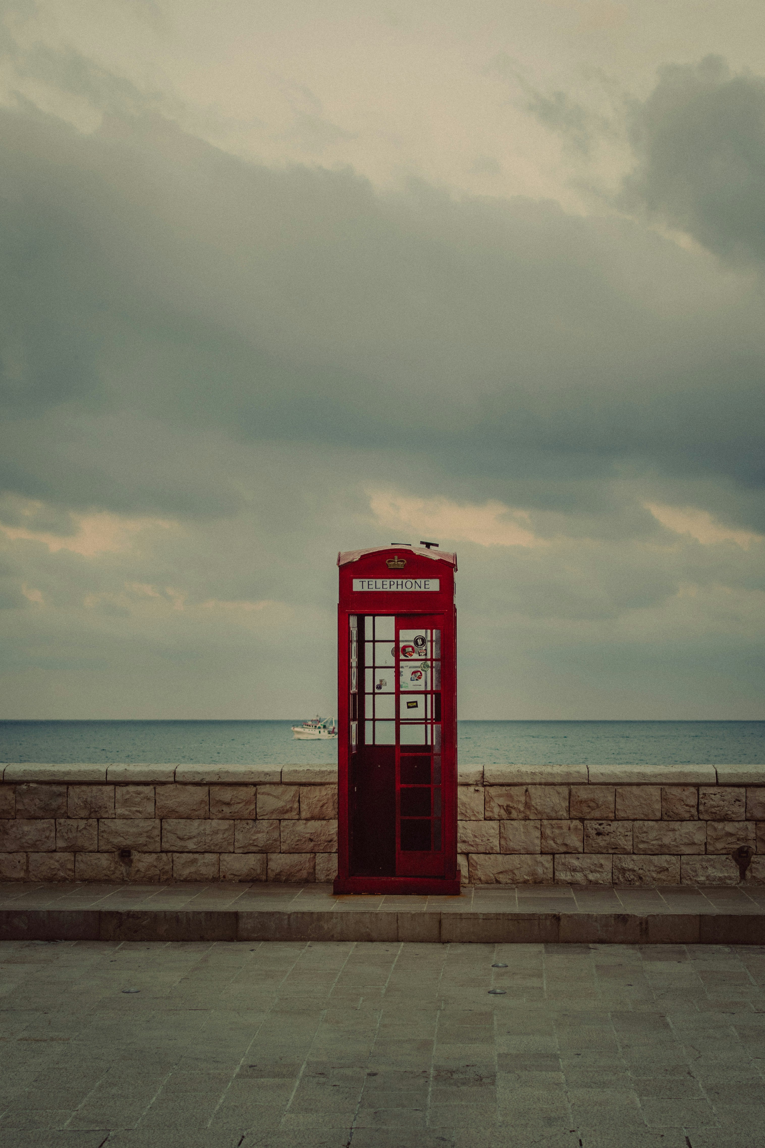 Crimson Kiosk at the Edge of the Sea