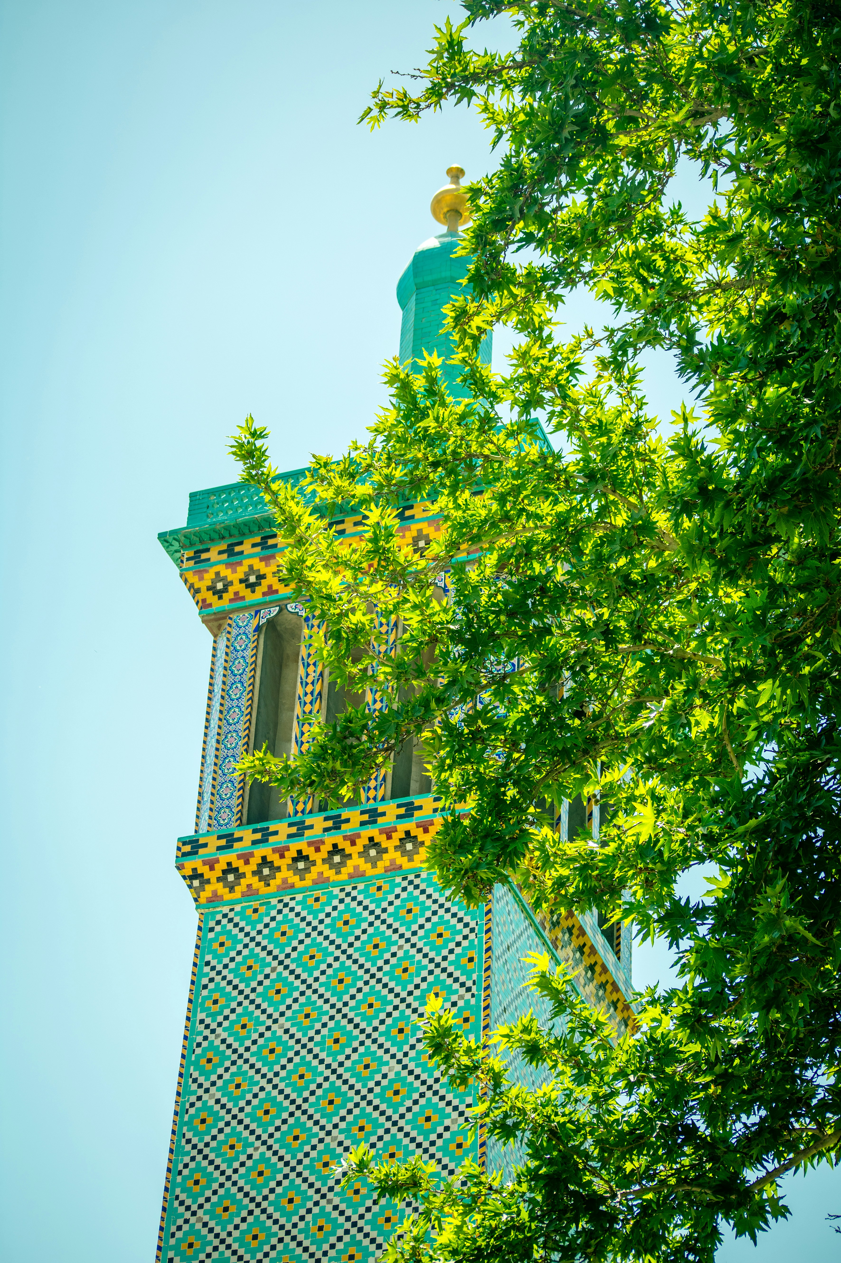 Emerald Veil Uncovers a Turquoise Mosaic Tower