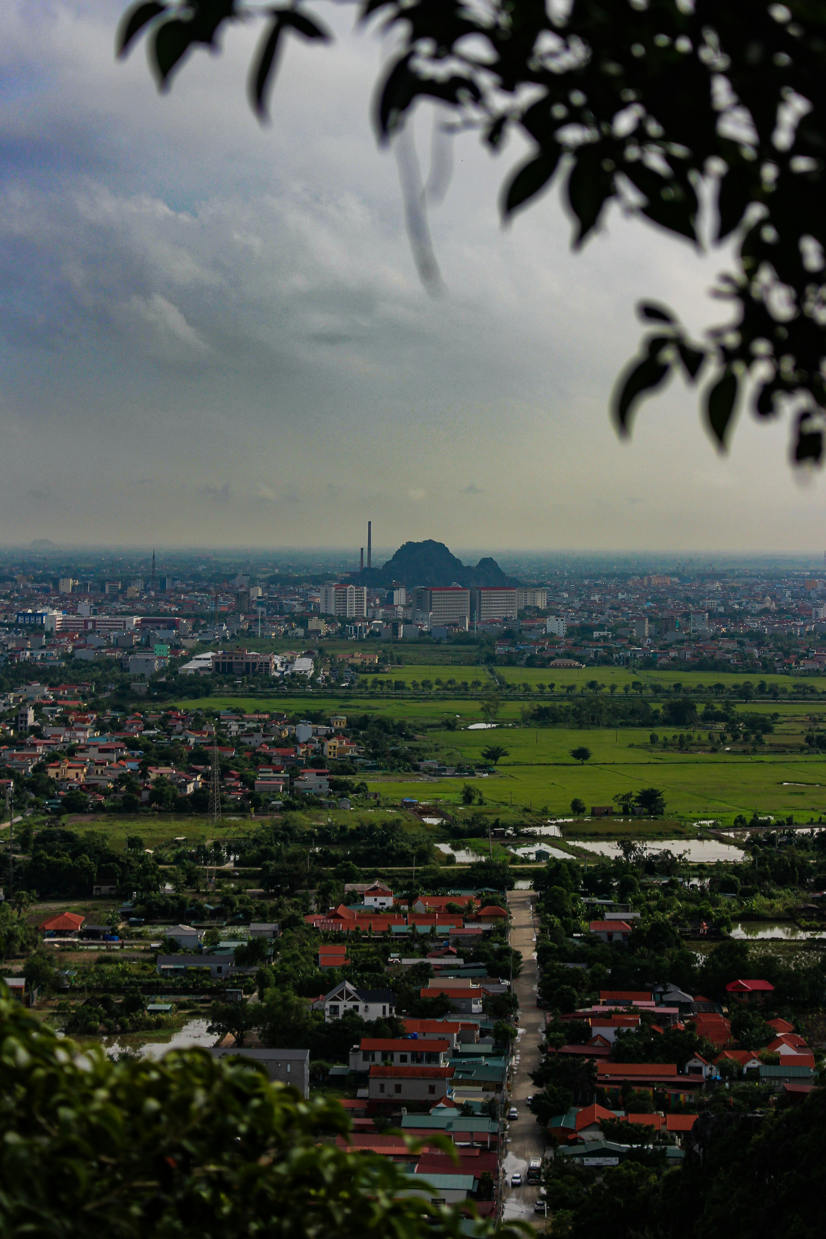 Hill Sentinel Over a Patchwork Valley City