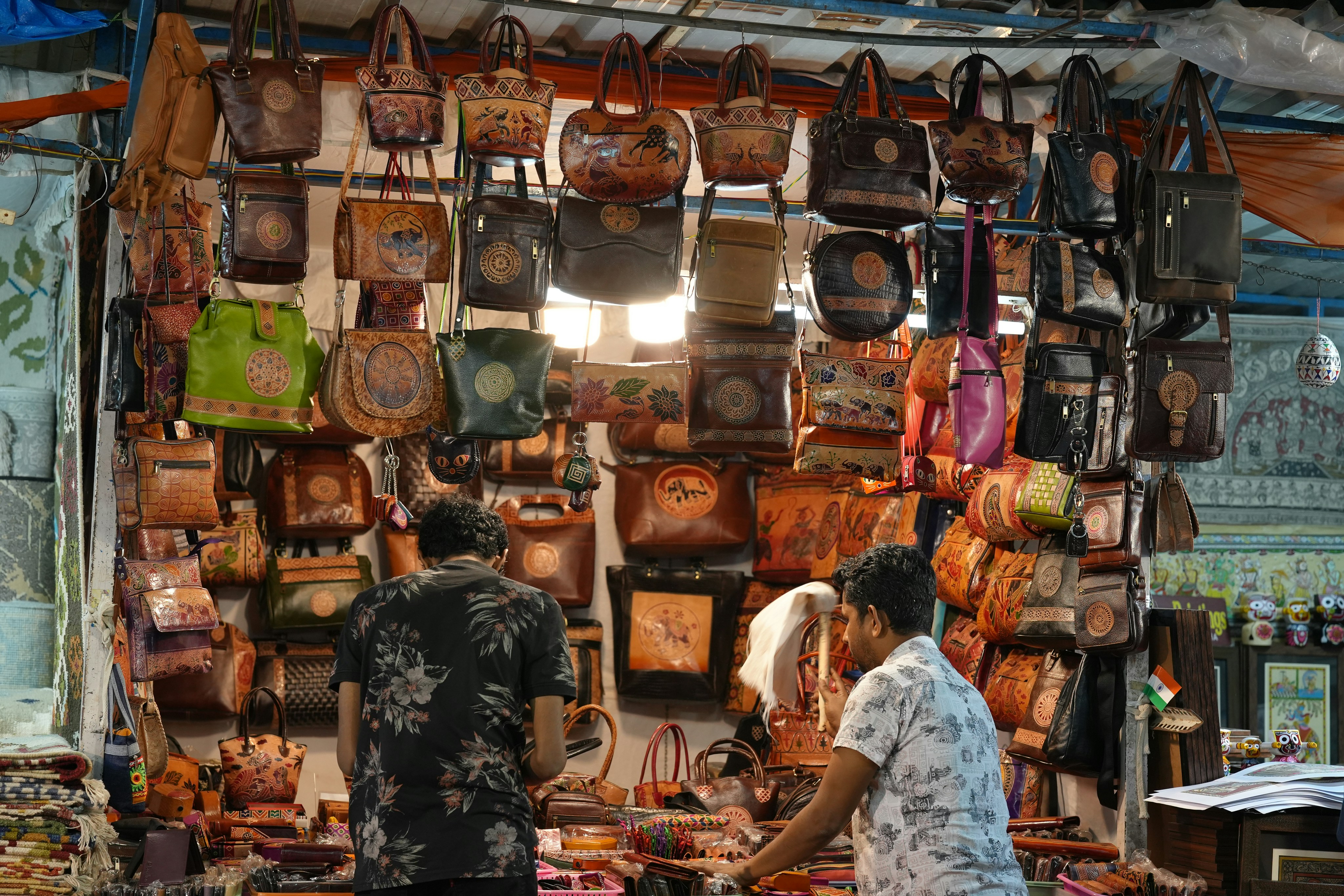 Leather-Laden Lane: Shoppers Navigate a Kaleidoscope of Bags