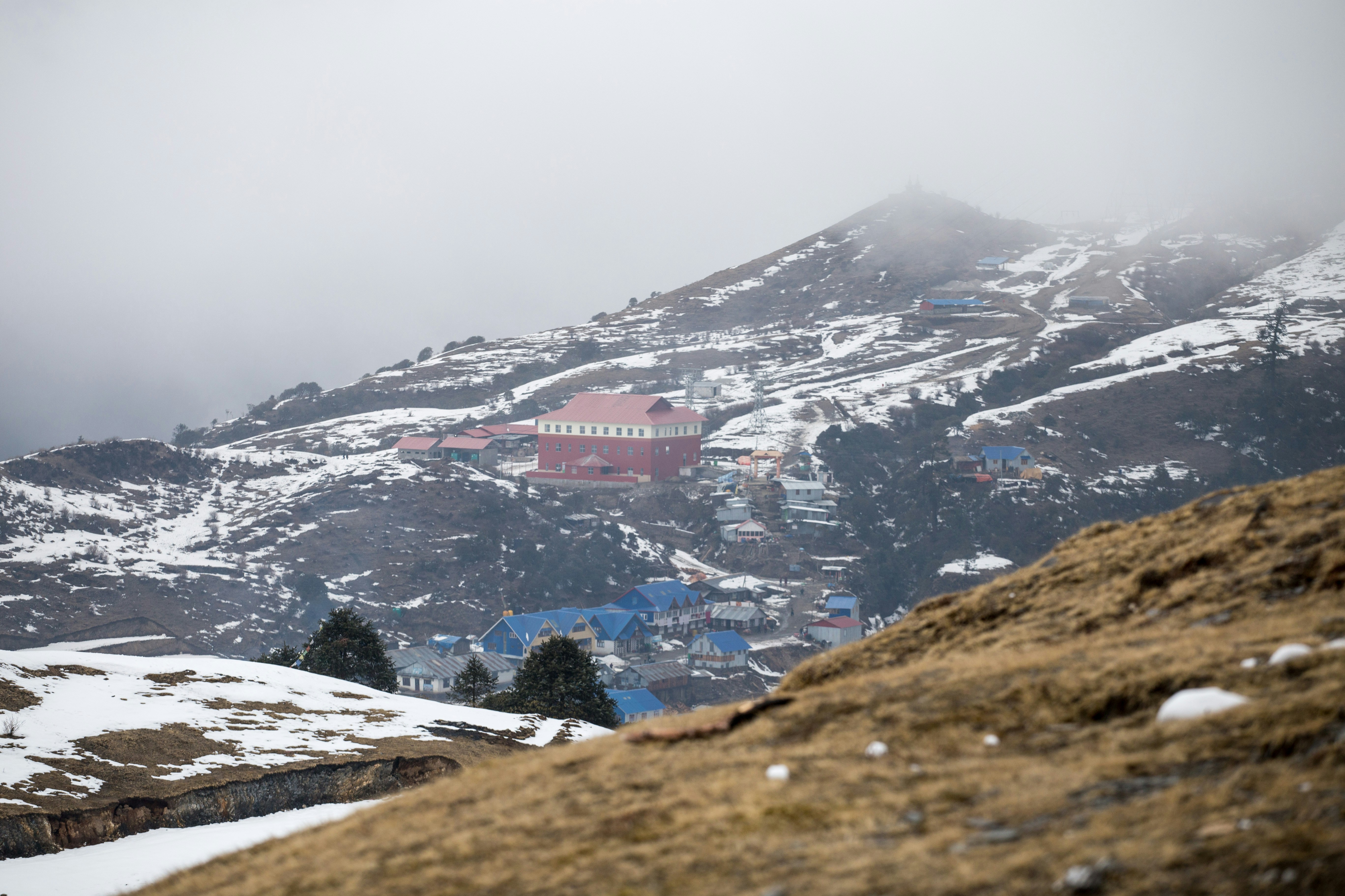 Snow-Covered Kalinchowk Village with Traditional Nepali Tea Houses