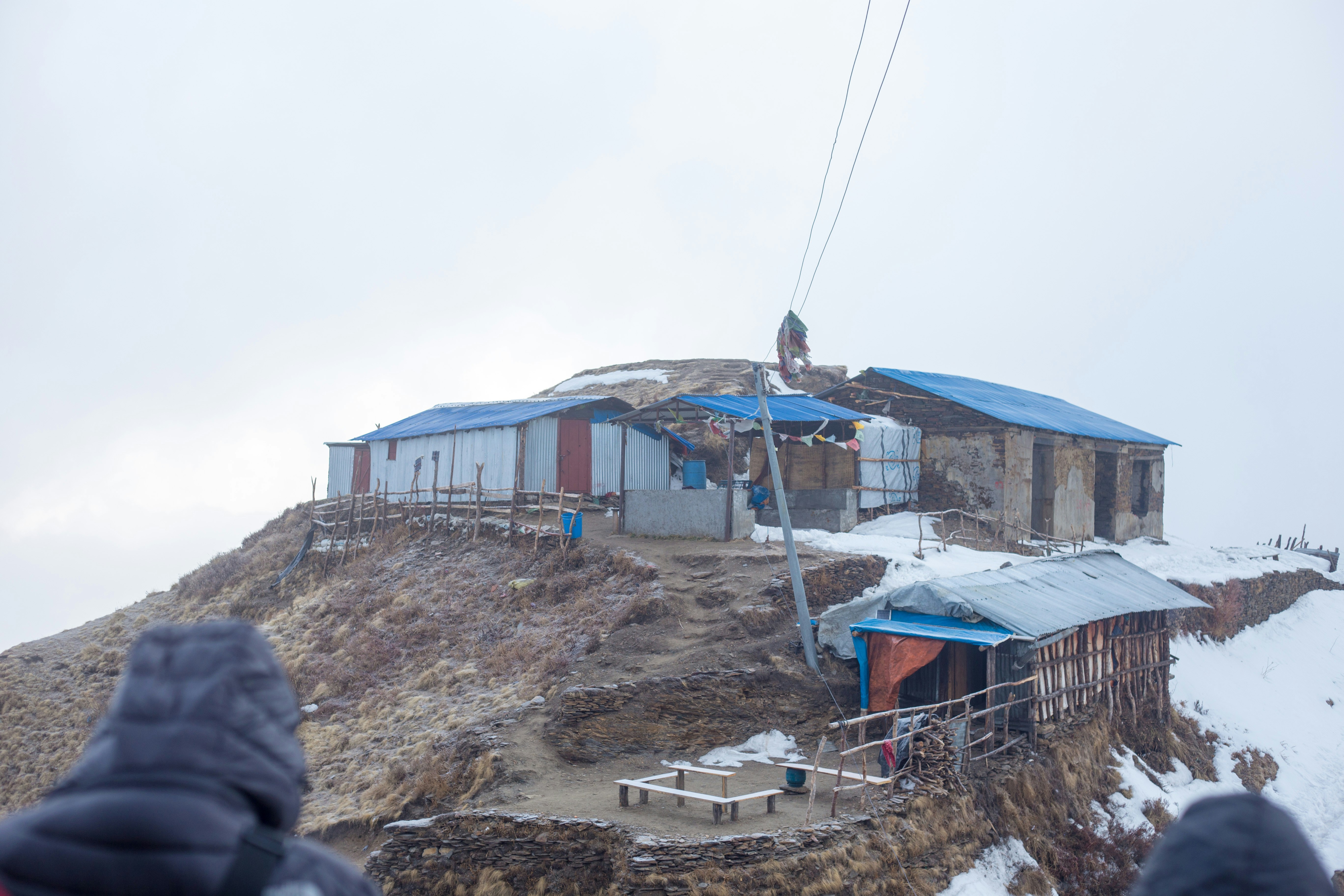 Blue Roofs on a Snowbound Slope: A Quiet Cable-Driven Outpost