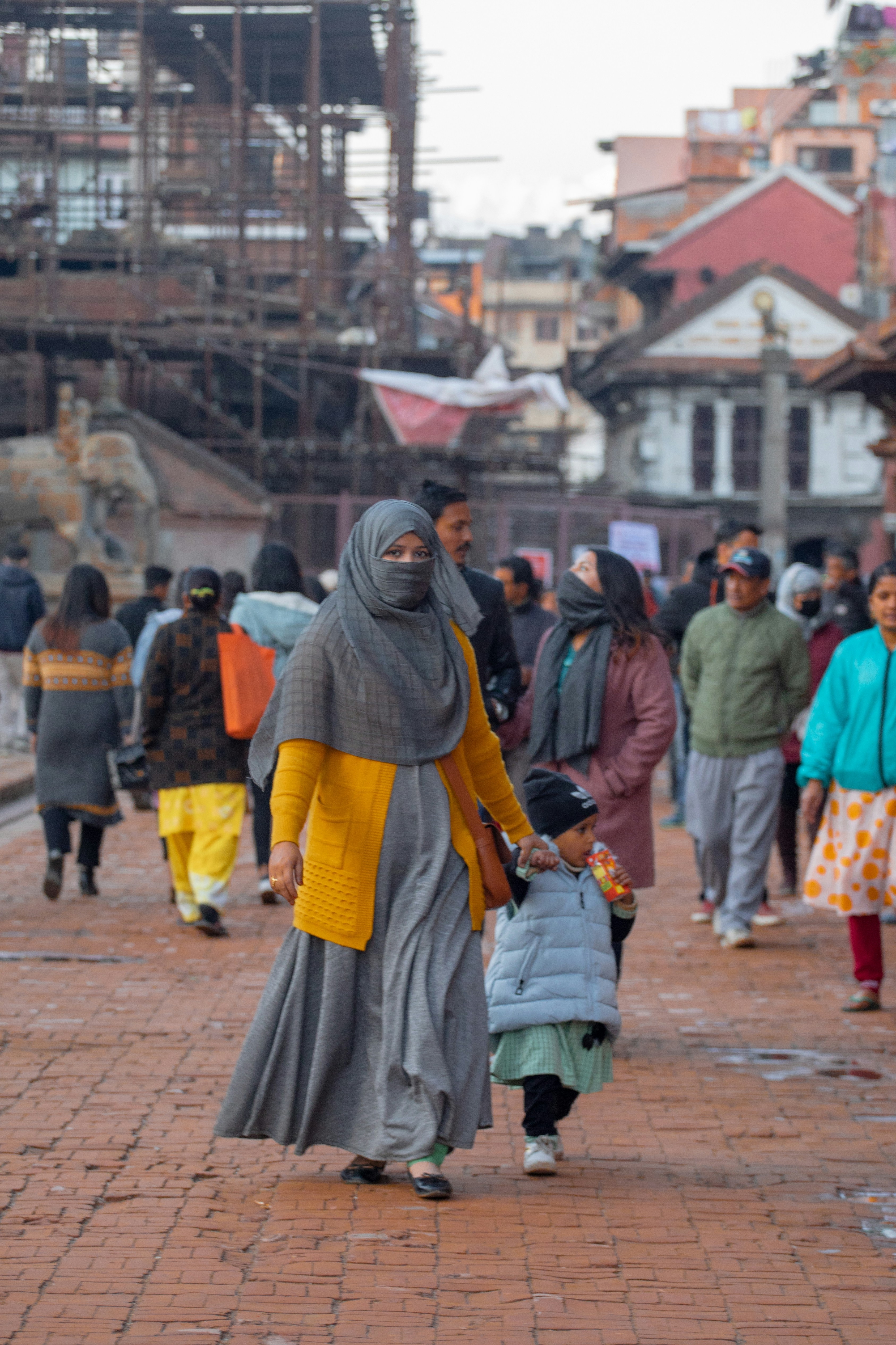 Woman Walking with Daughter at Patan Durbar Square