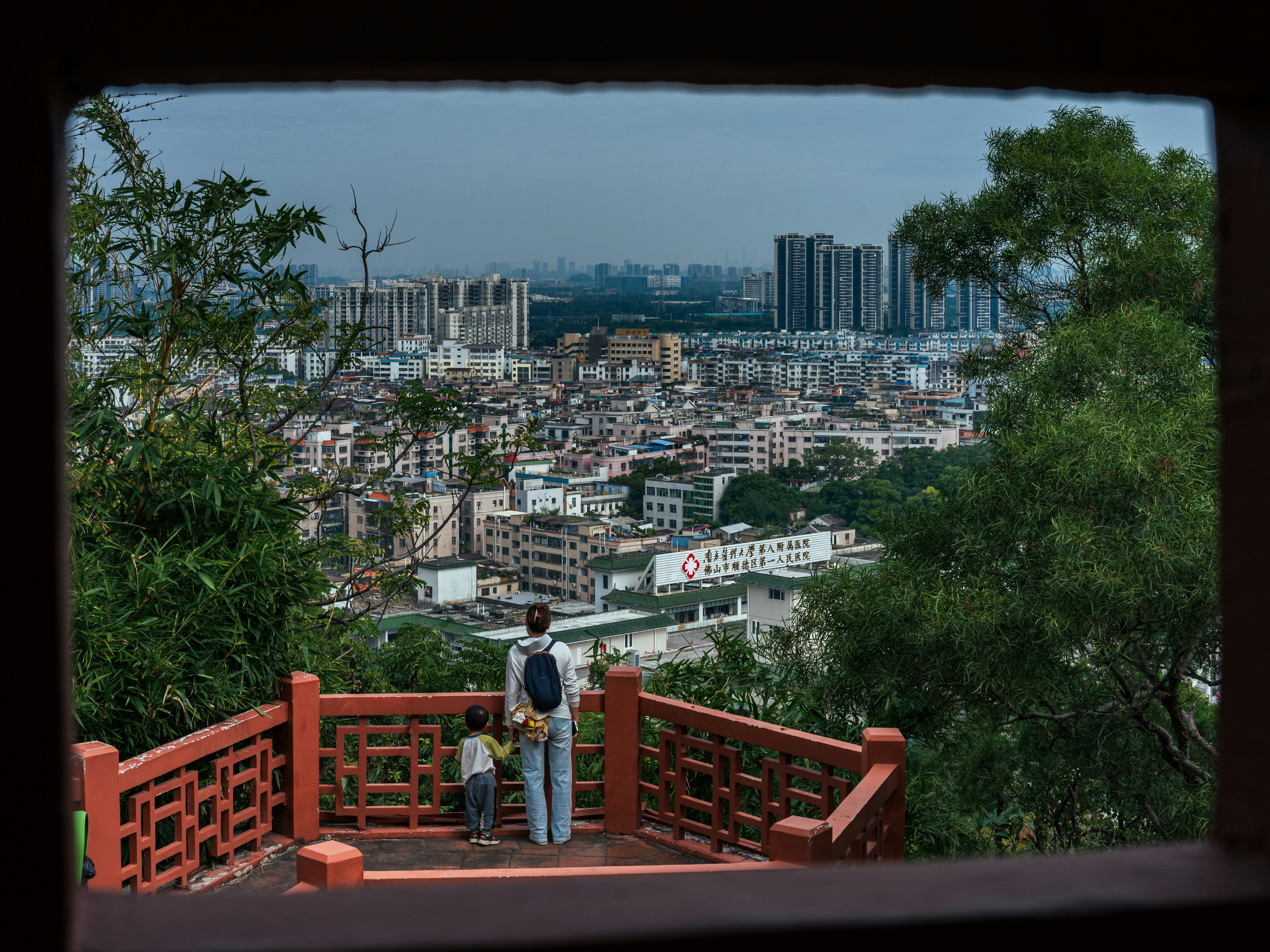 Red Railing Overlook: A Small Pause Above the City Mosaic