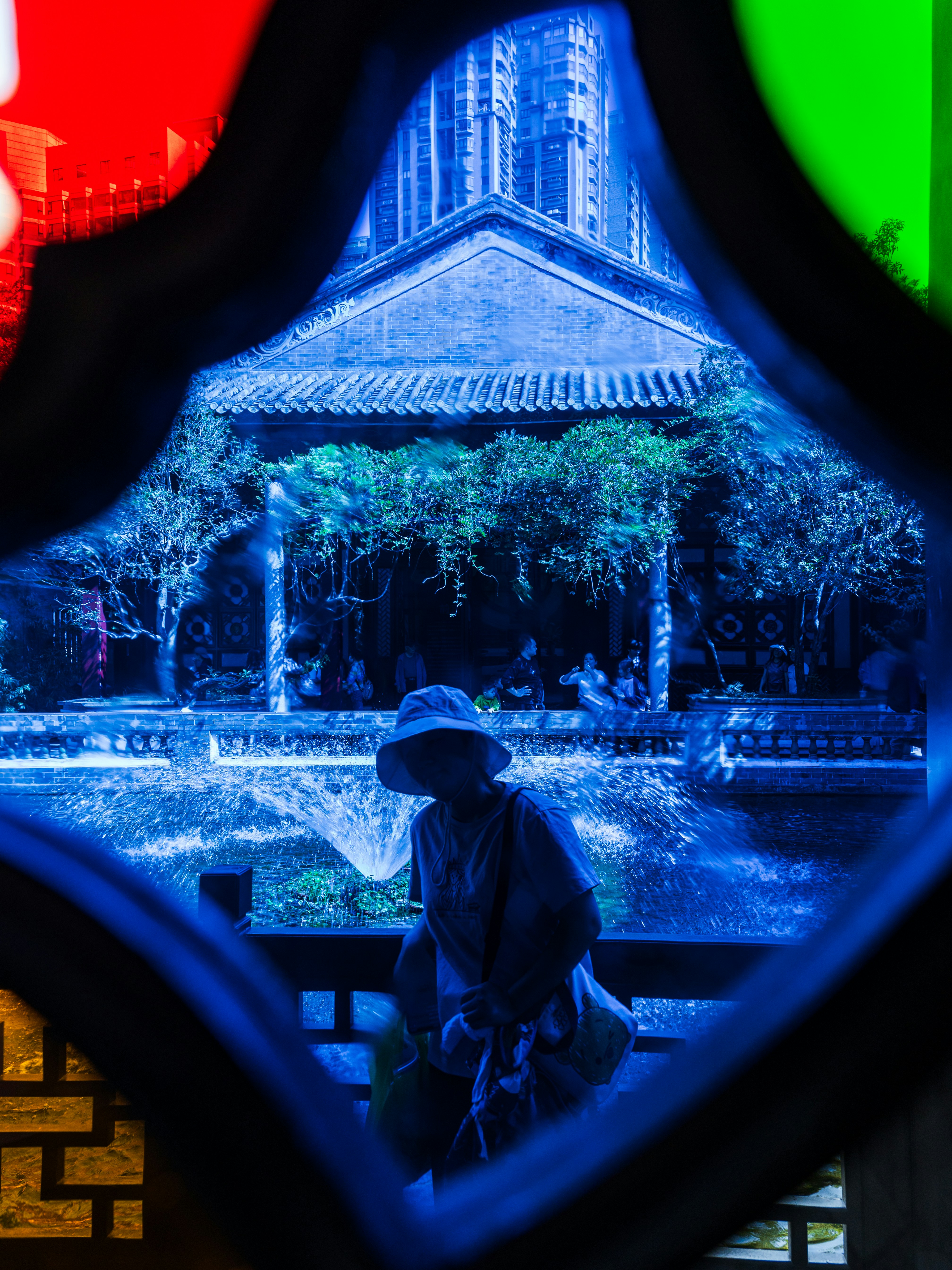 Color-Framed Silhouette in a Blue Courtyard