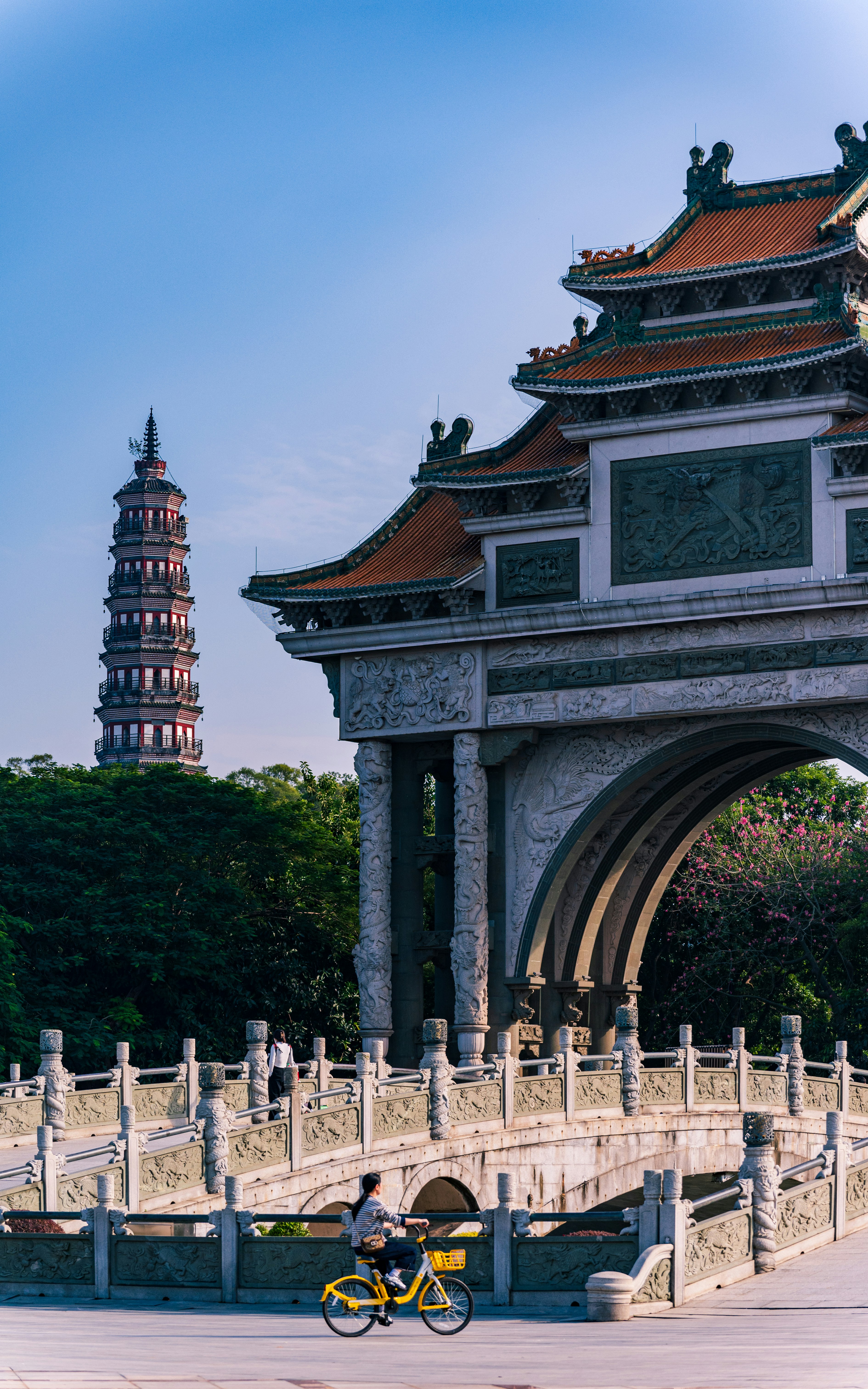 Archway to Serenity: Gate, Bridge, and a Distant Pagoda