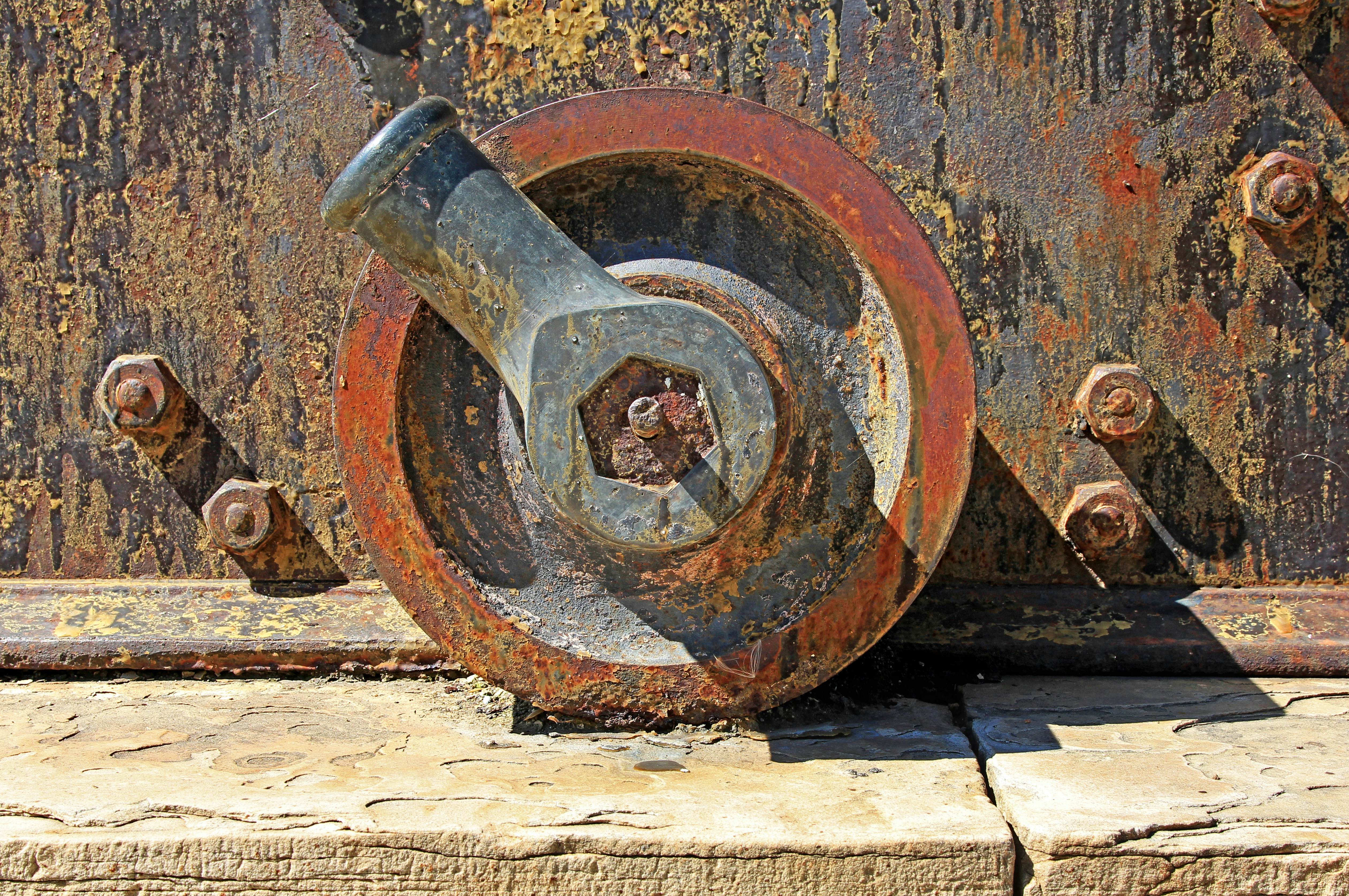 The Weathered Wheel: Rusted Rail Hub in Close Focus