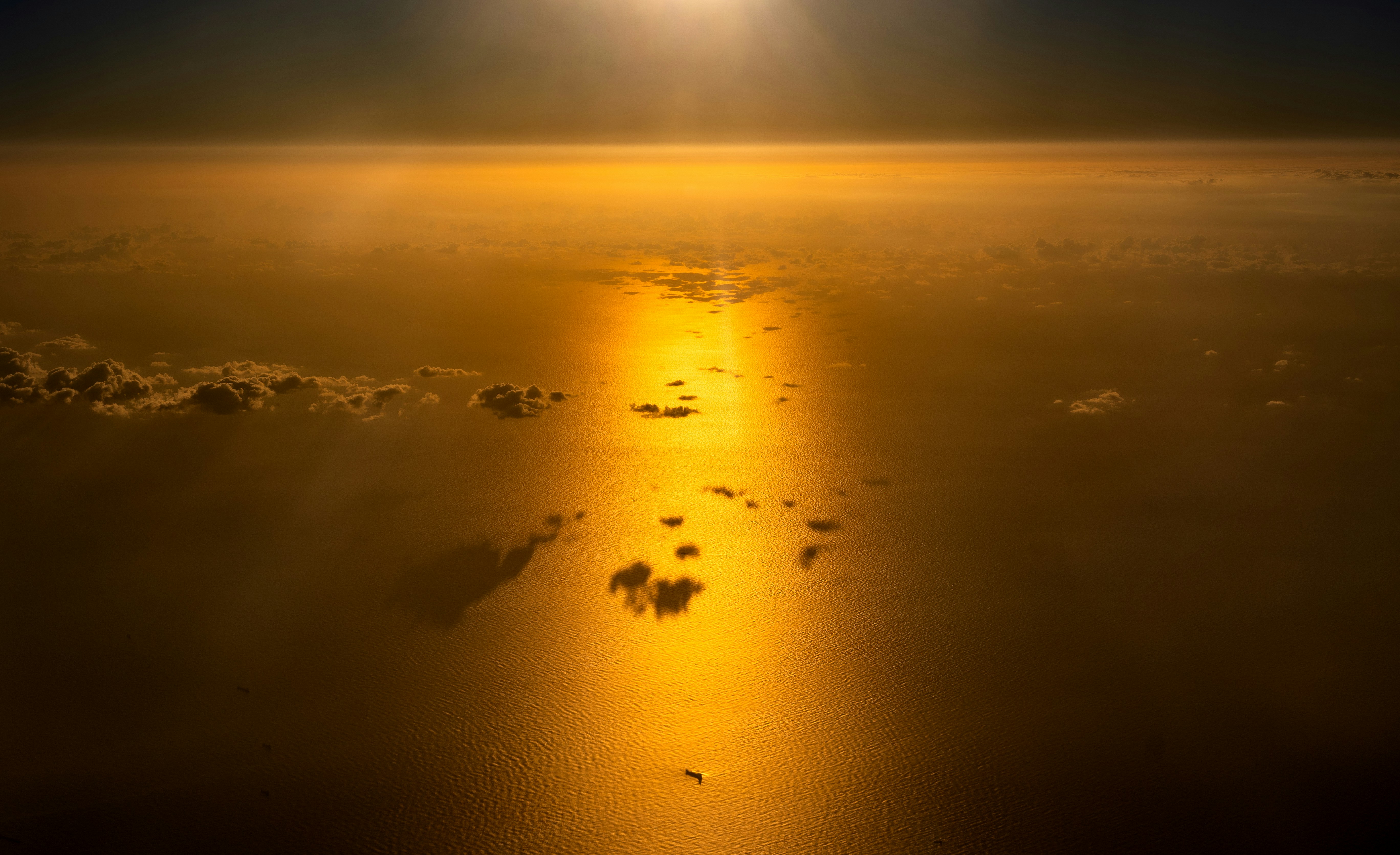 Dawn's Golden Ribbon: A Quiet Sea Bathed in Liquid Ember