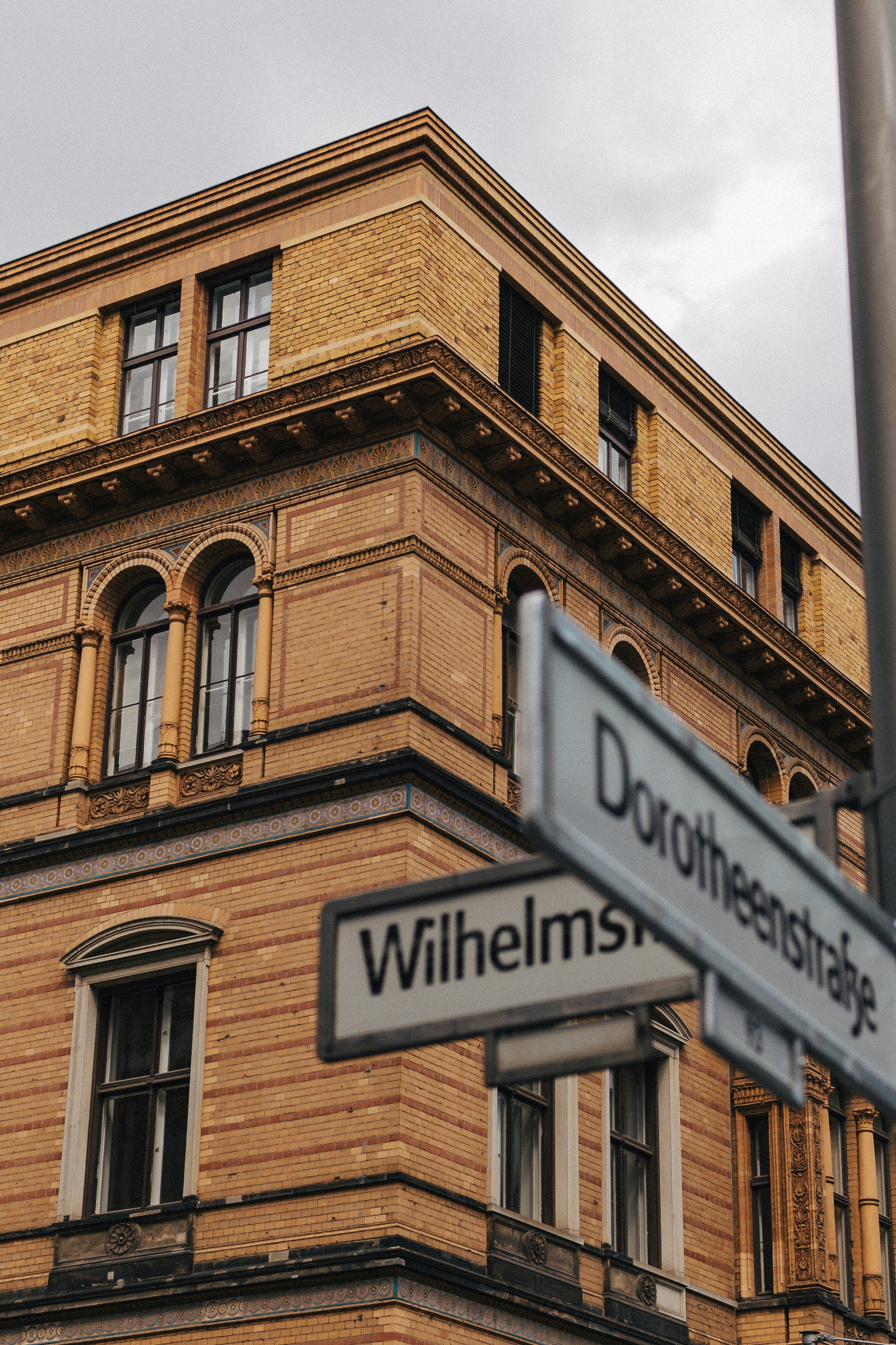 Corner of Wilhelmstraße: Brickwork Geometry Under Cloudy Light