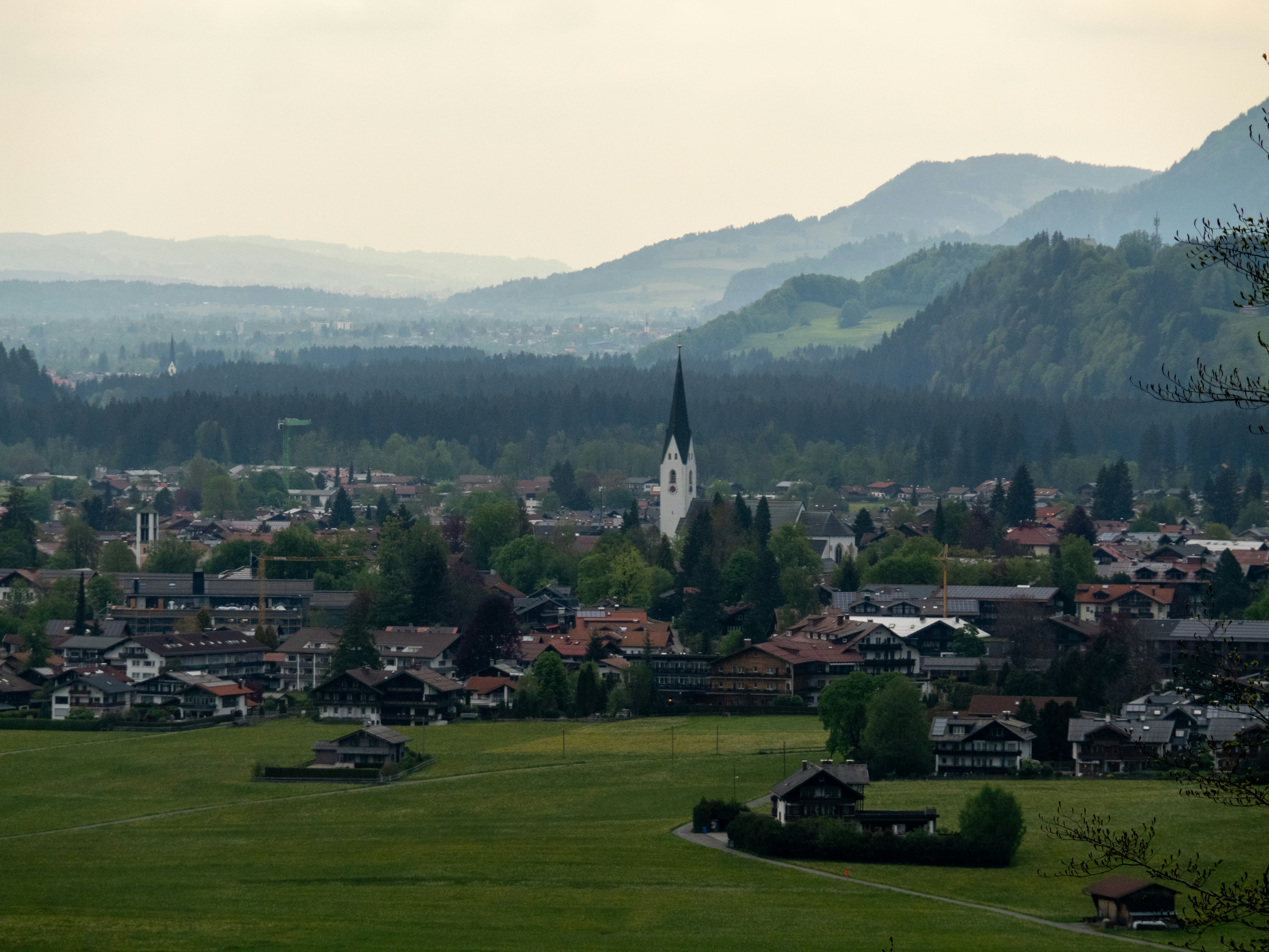 Spire Over the Green Valley Village