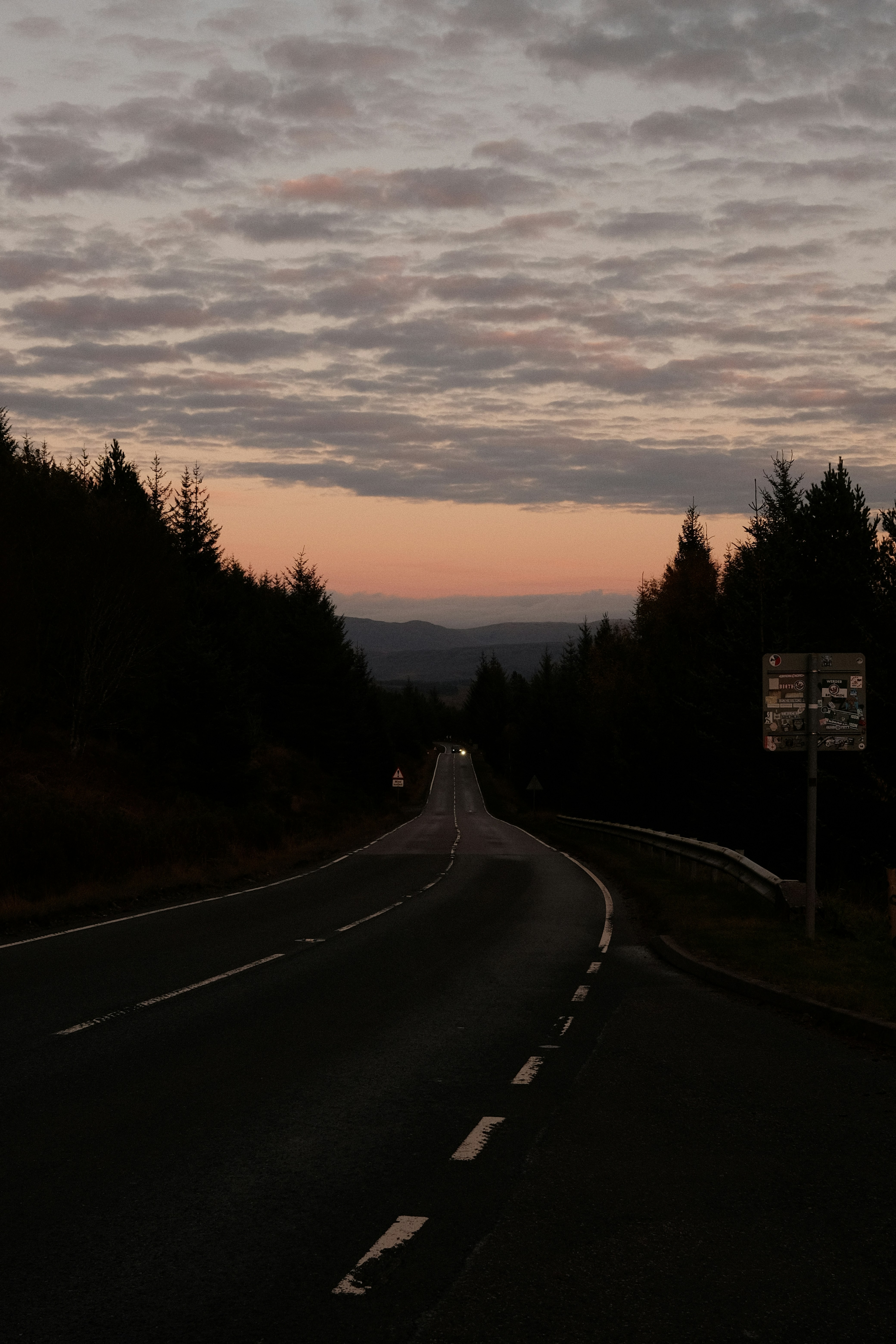 Twilight Highway: Distant Hills Beyond the Winding Road