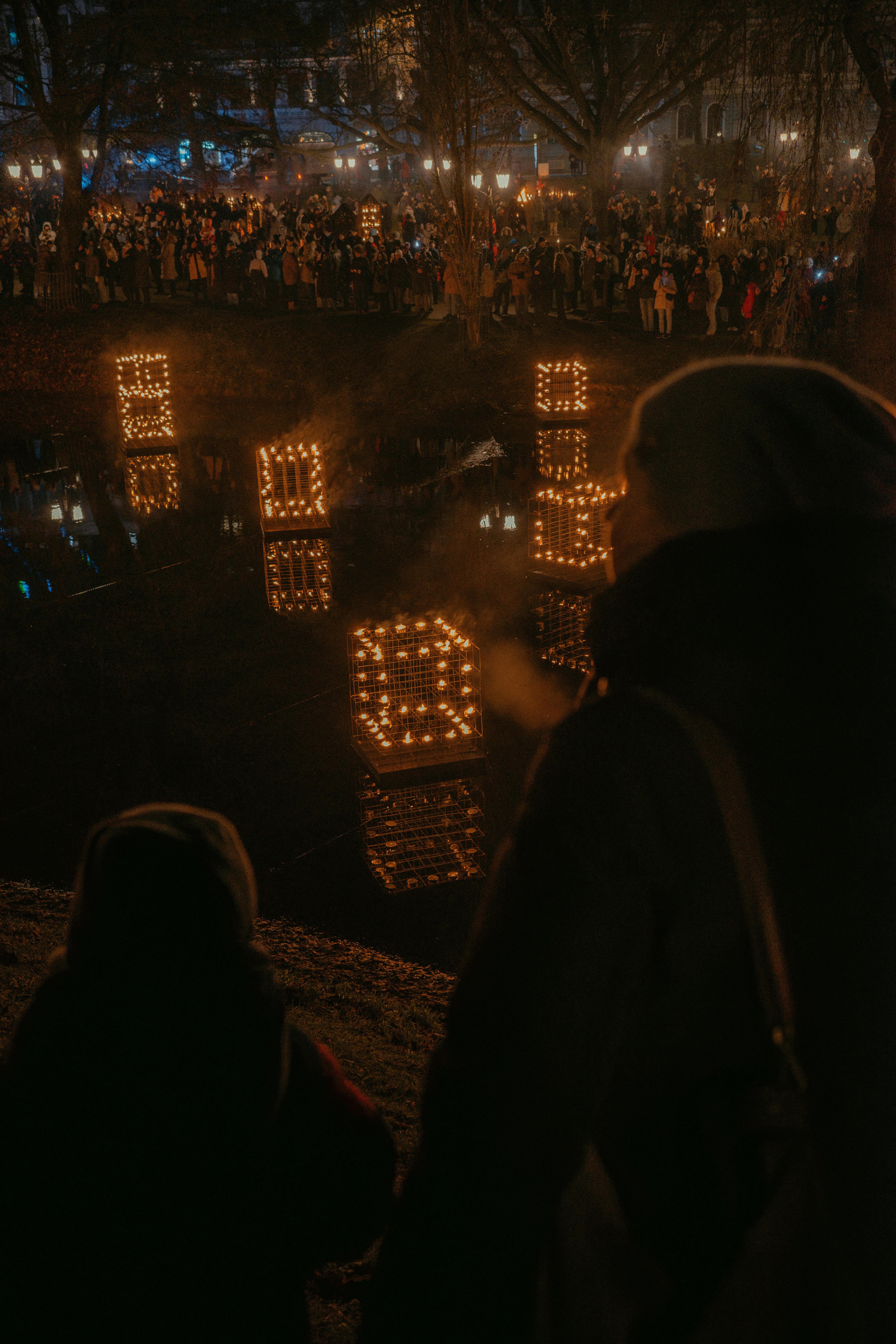 Floating Lantern Cubes Ignite the Night at a Park Pond