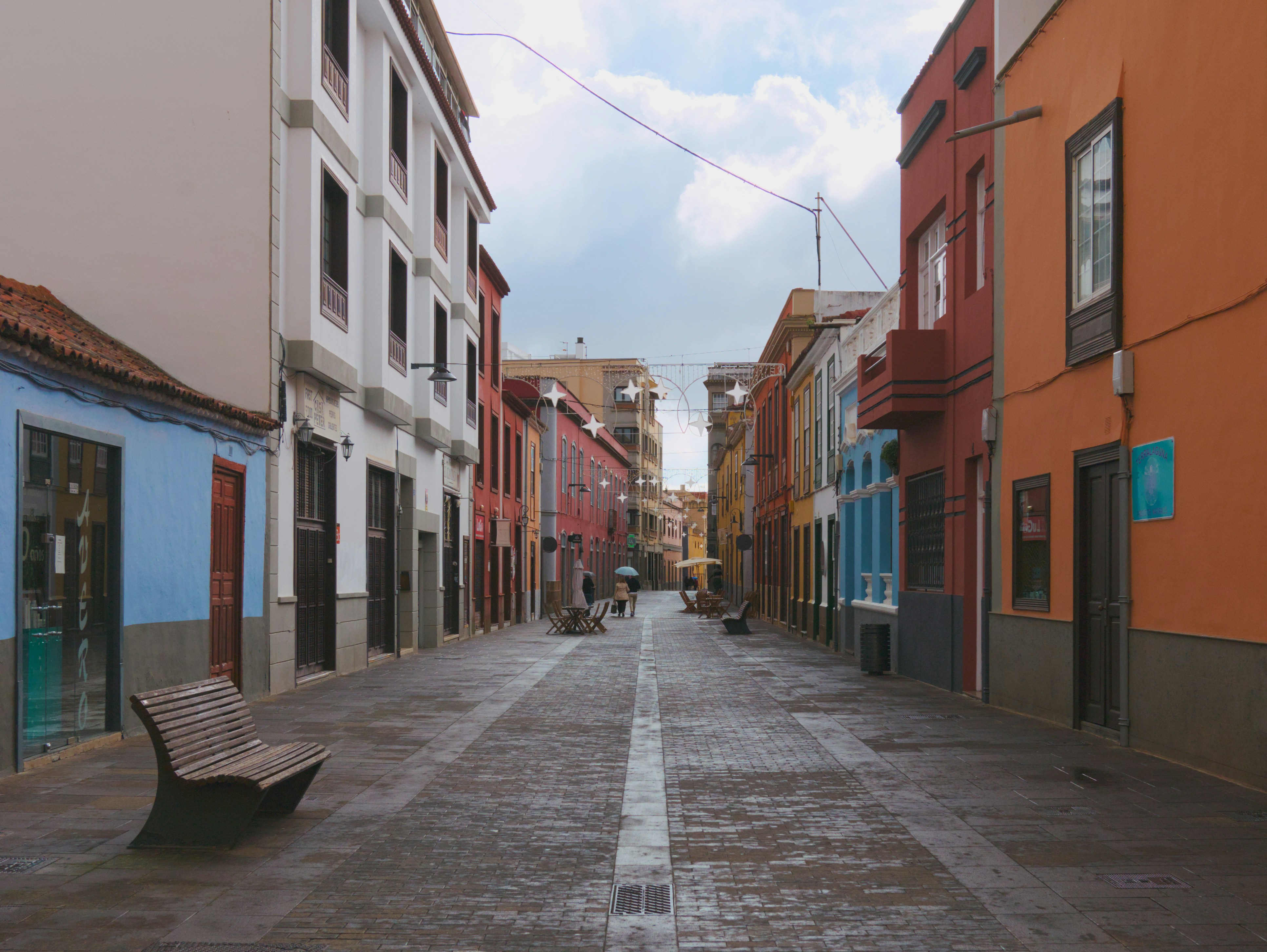 Corridor of Hue: A Colorful Street Reaching Toward a Clouded Horizon