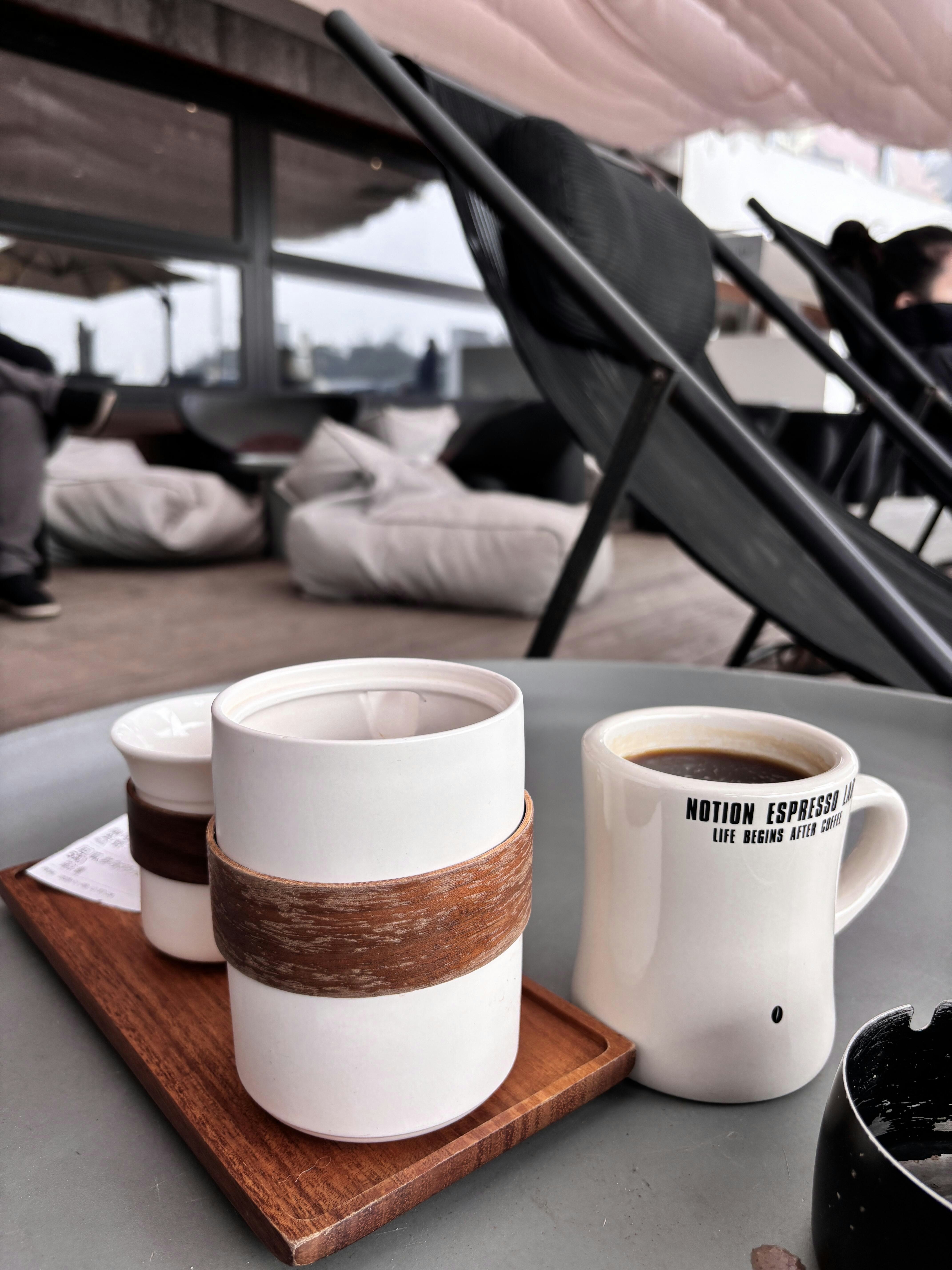 Rustic Ceramic Mugs on a Wooden Tray, Sunlit Café Terrace