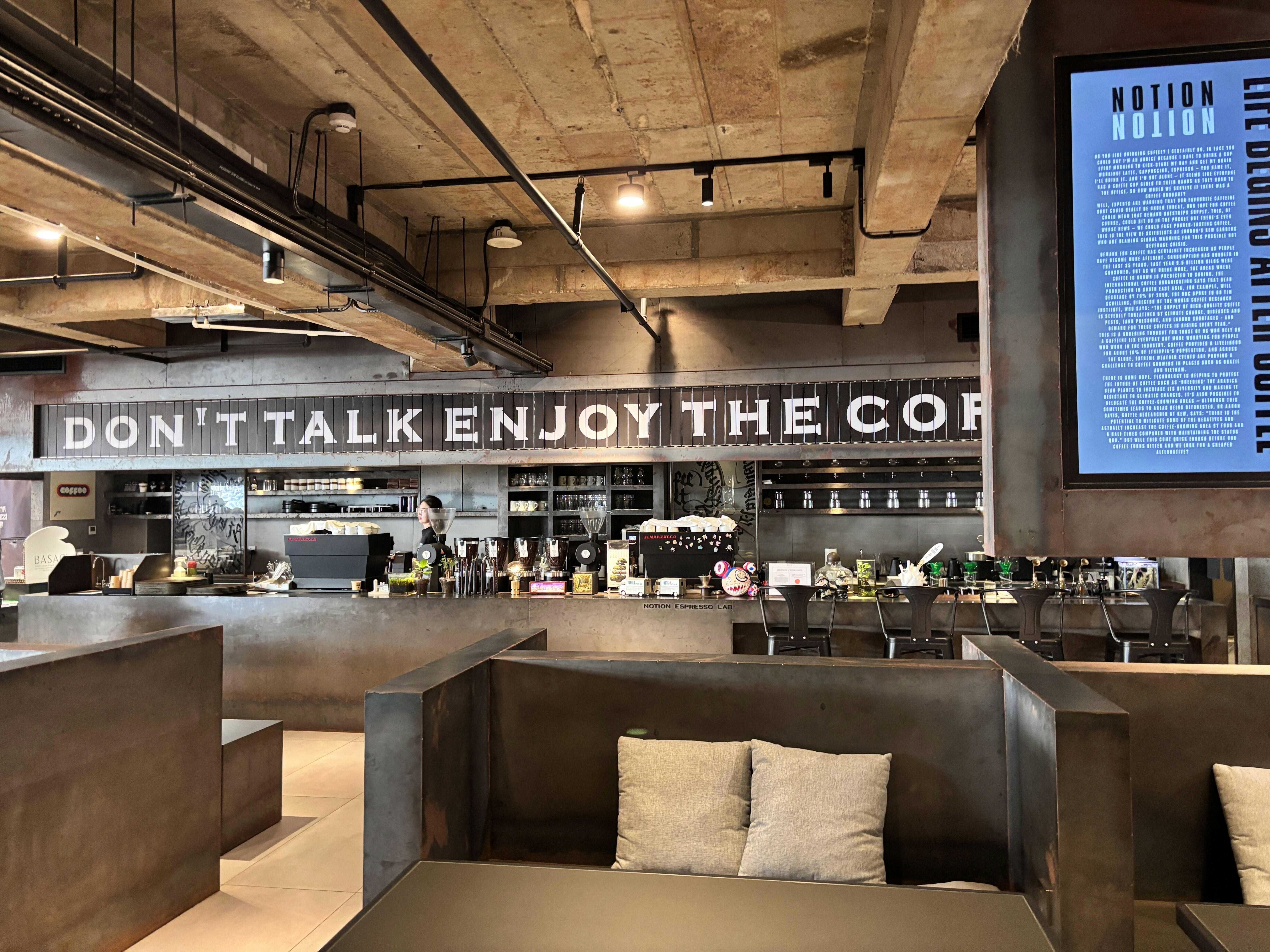 Modern coffee shop interior with seating and counter