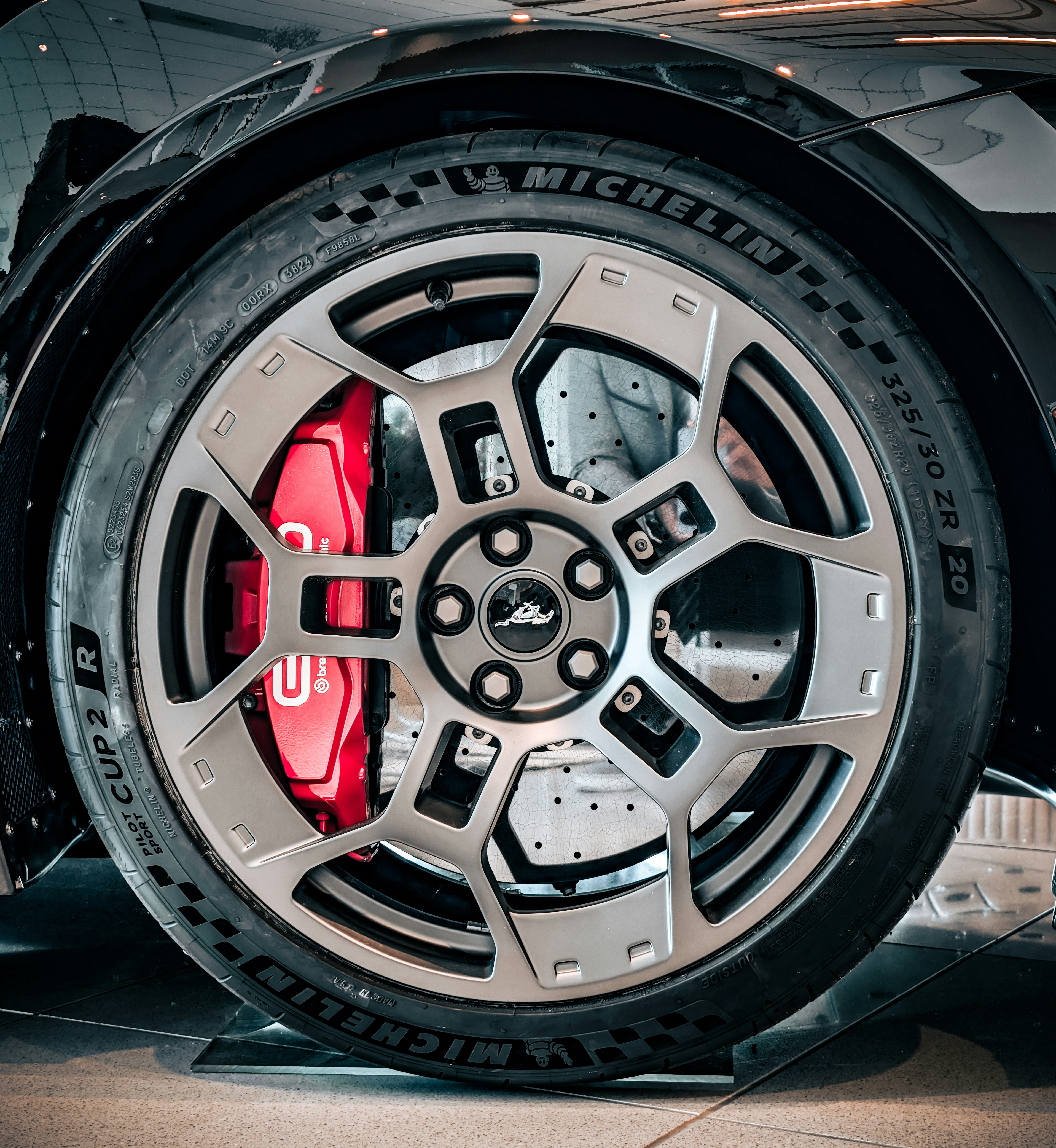 Witness the breathtaking geometry of this precision-engineered masterpiece. That vivid scarlet caliper contrasting against the sleek, industrial matte finish represents pure automotive perfection and high-performance elegance at its finest. Boulevard Ford in Millsboro.