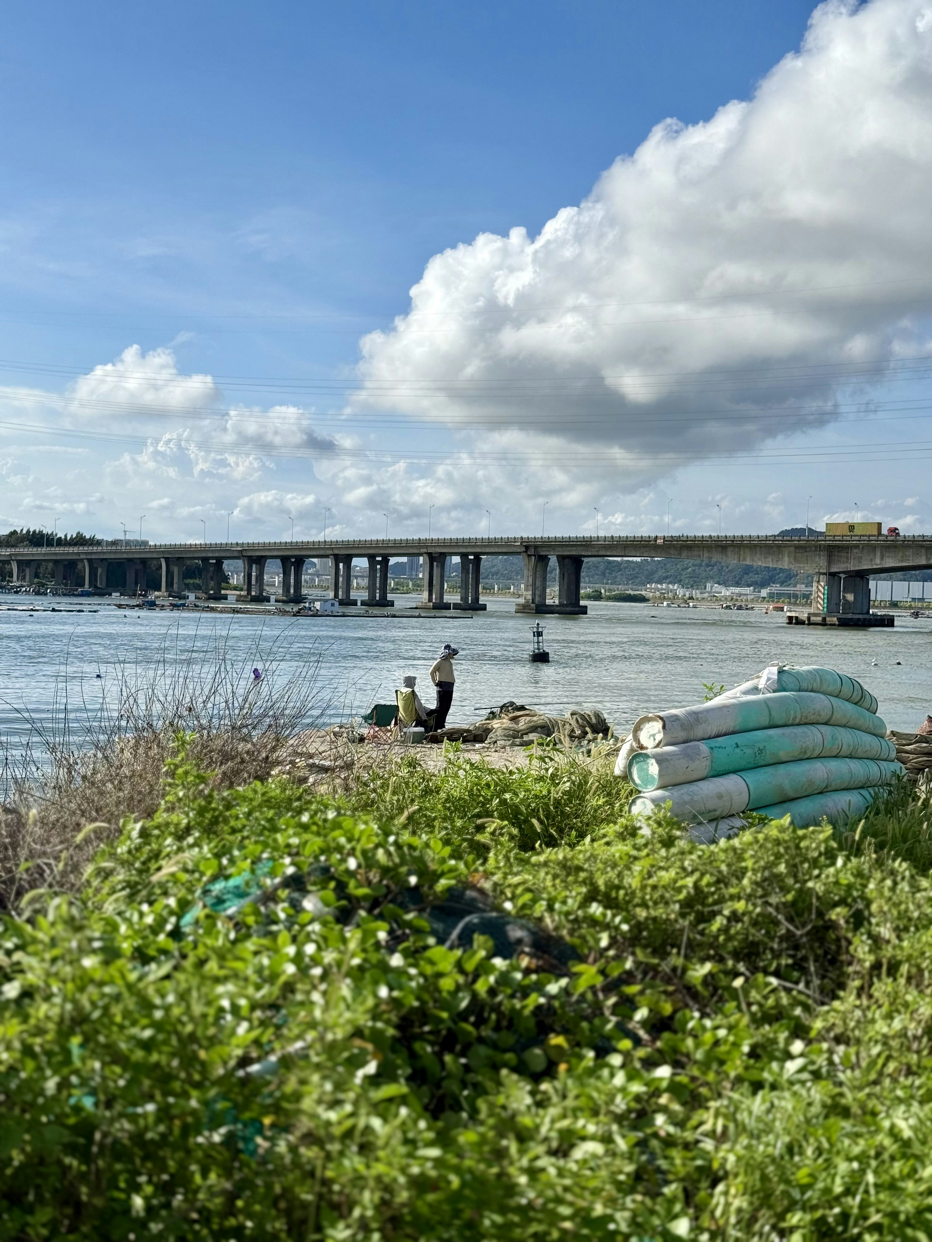 Bridge-Side Quiet: Angler by the Riverbank