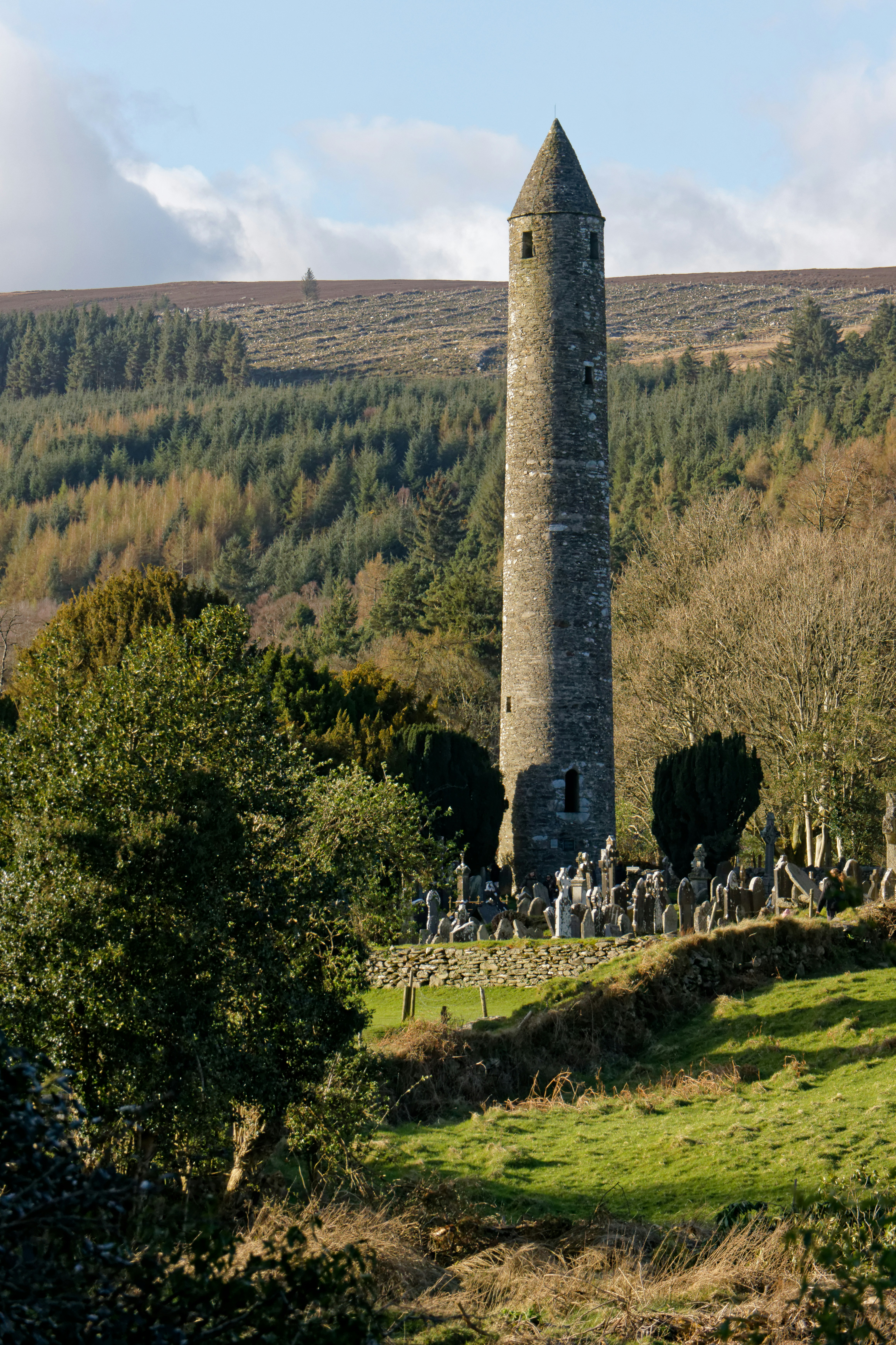 Stone Sentinel Over the Graves: Round Tower in Autumn Light