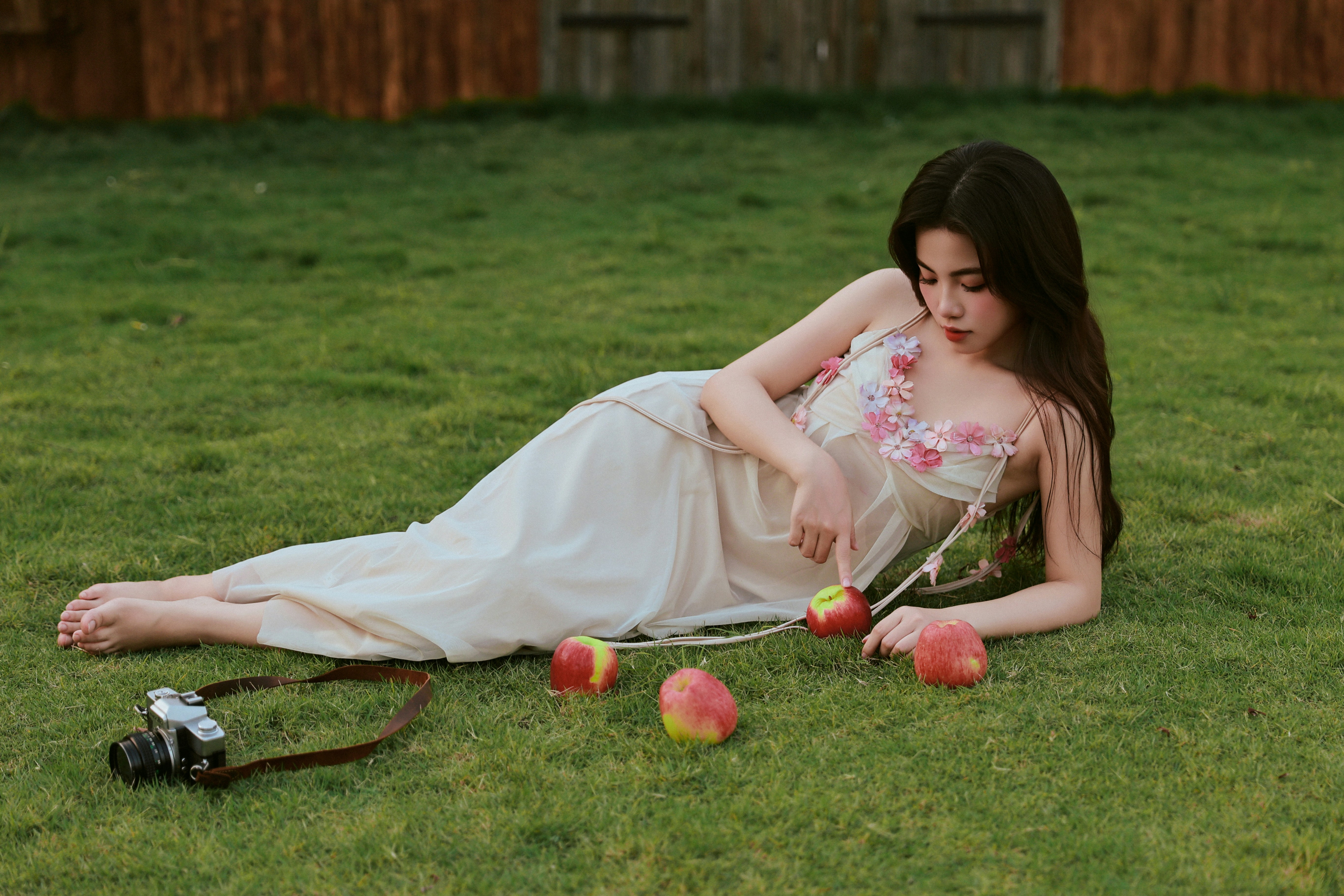 Whispering Grass Portrait: Velvet Dress, Apples, and a Vintage Camera