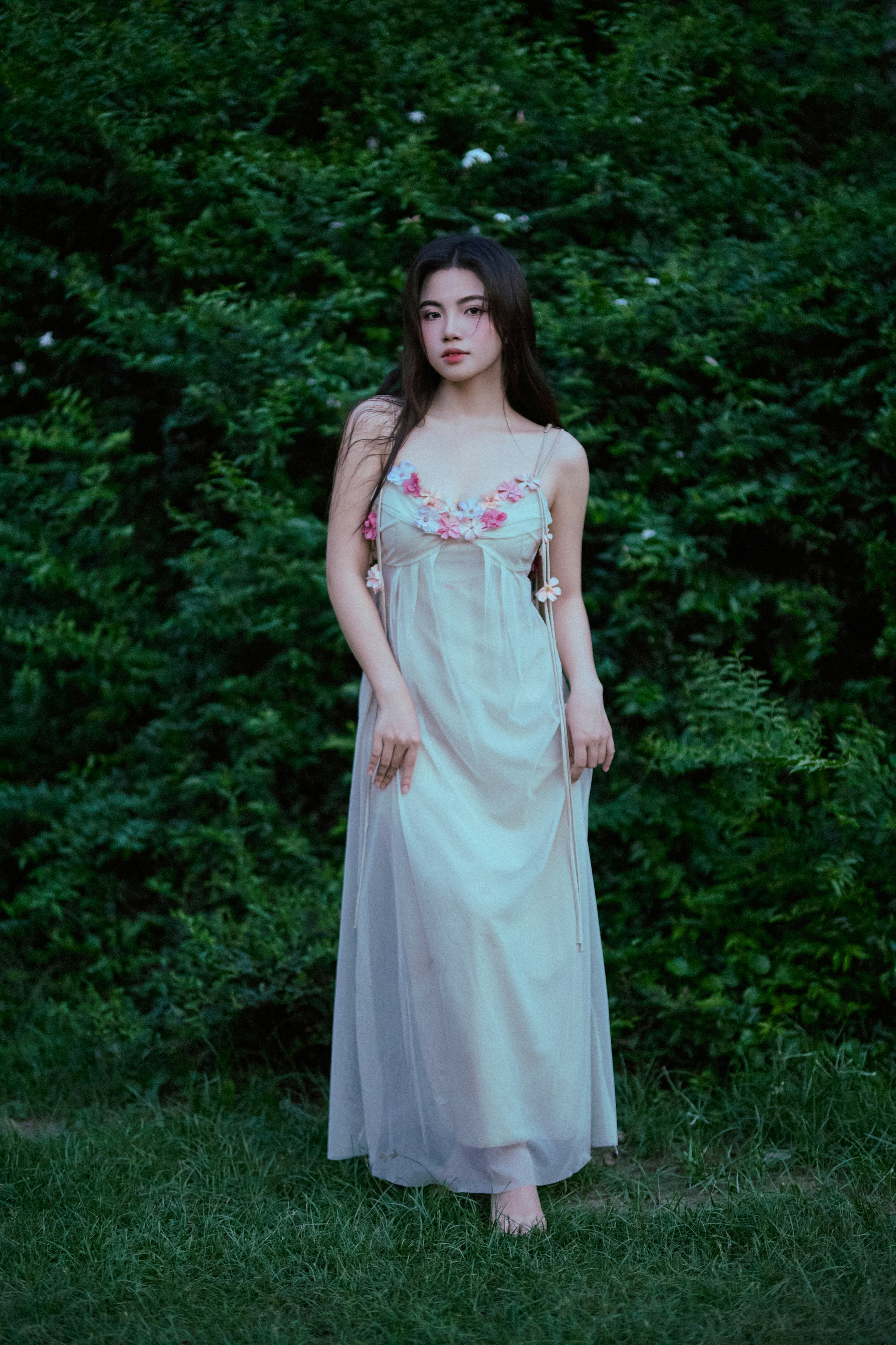 Female portrait with dramatic lighting and red apple.