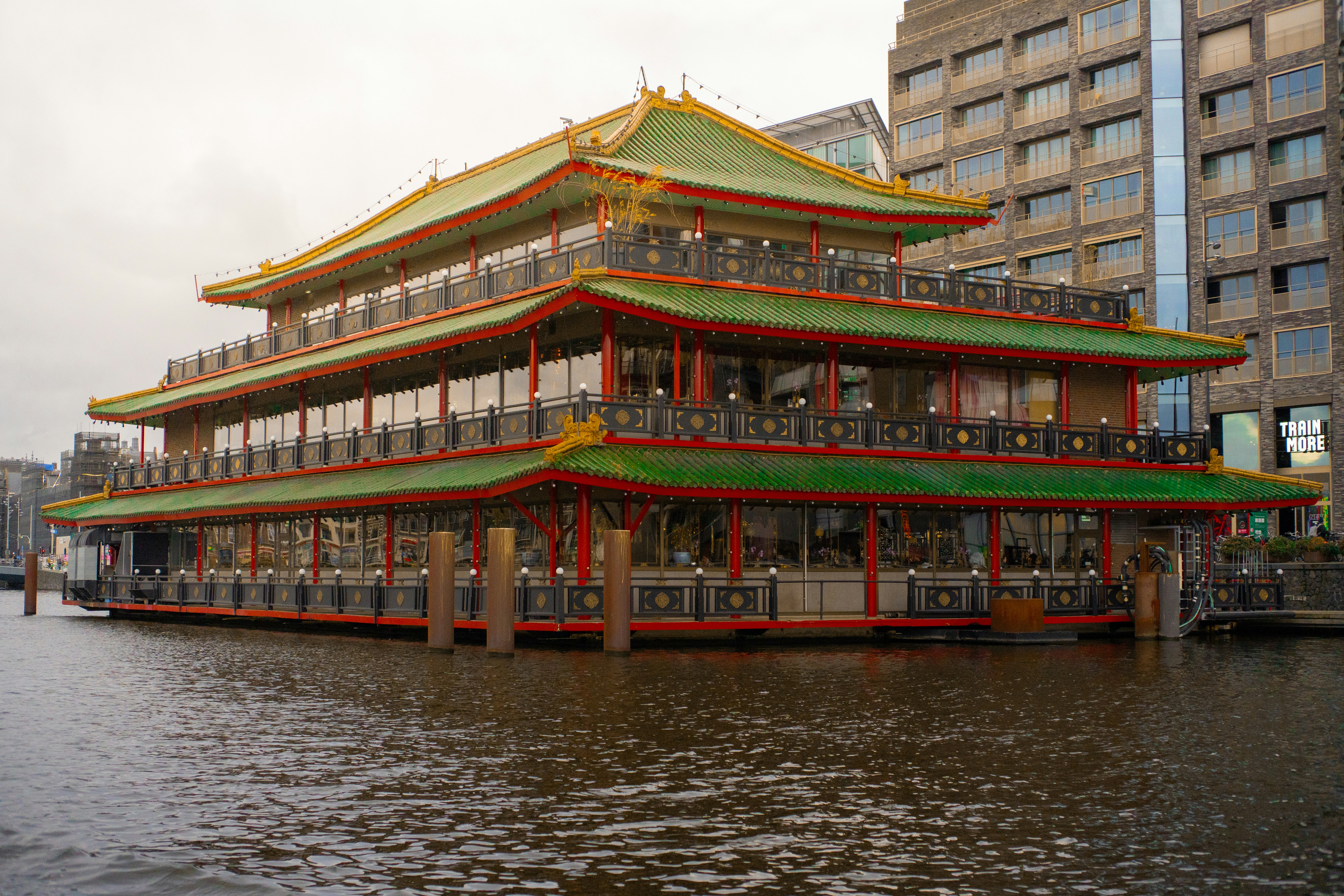 Emerald Pagoda on the Water: A Triple-Tier Riverboat by the City