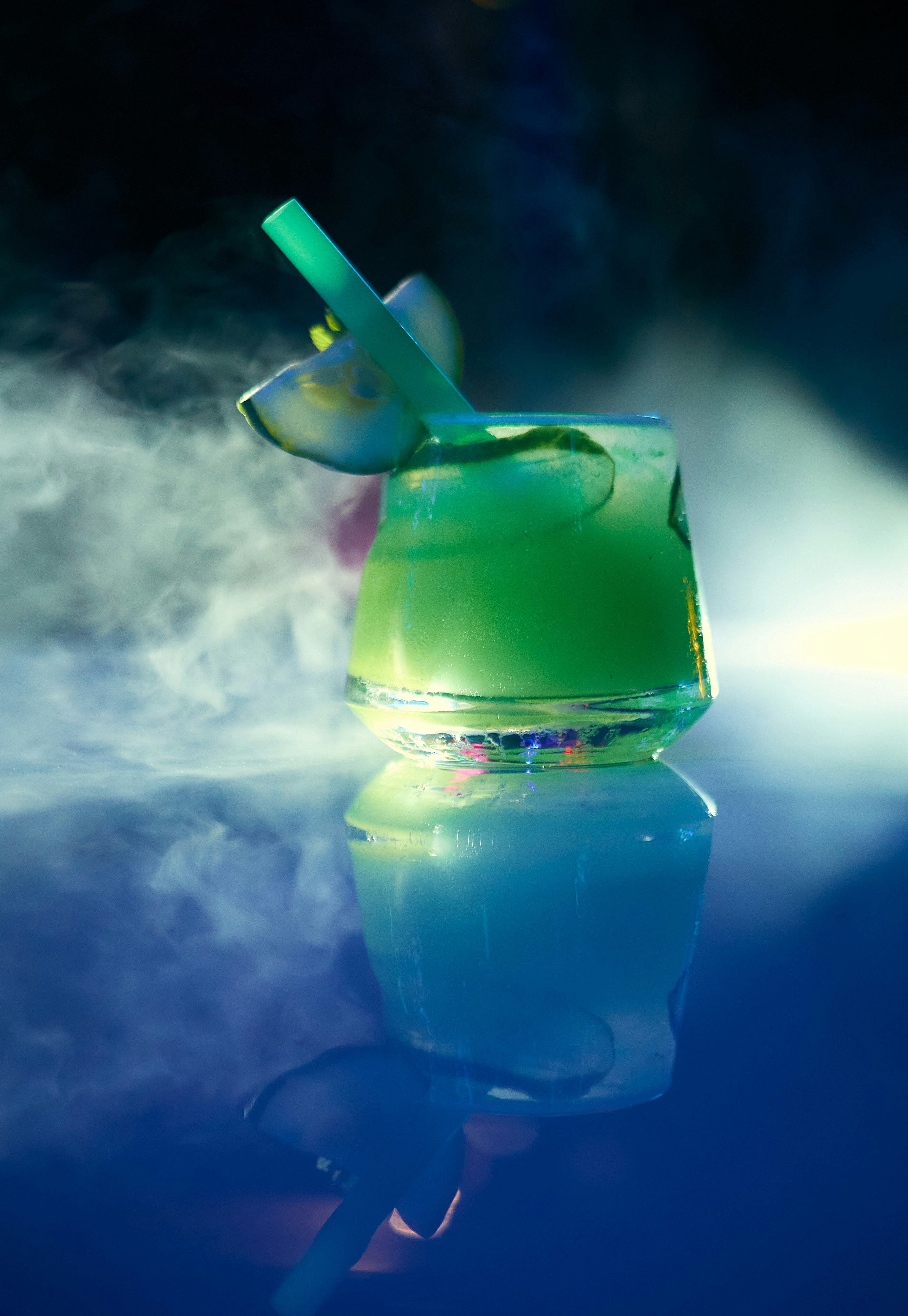 Emerald Mist: Neon Cocktail in a Smoky Reflective Scene