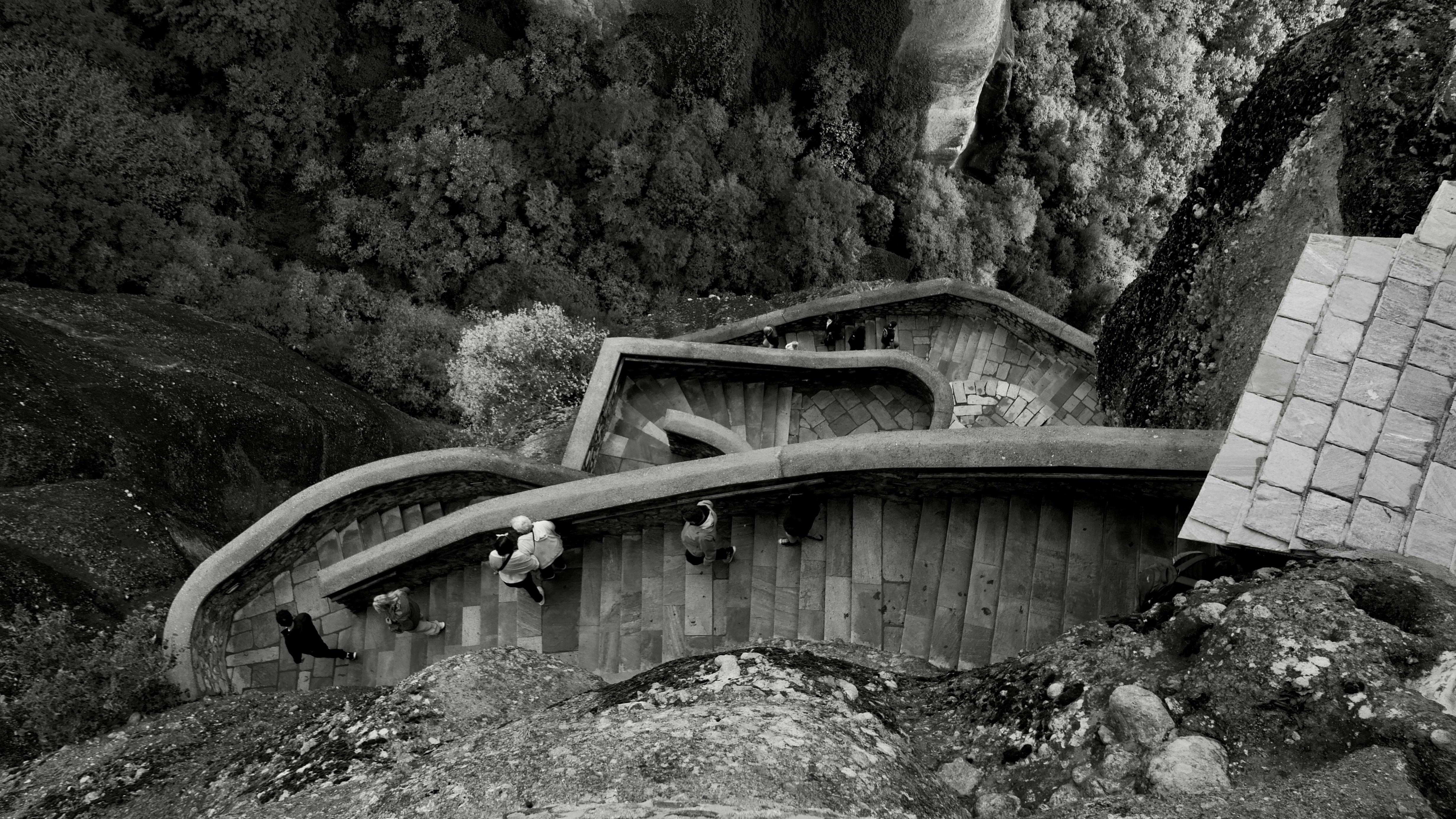 Curve of the Cliff Staircase: Timber Rails Carve a Path Along Stone