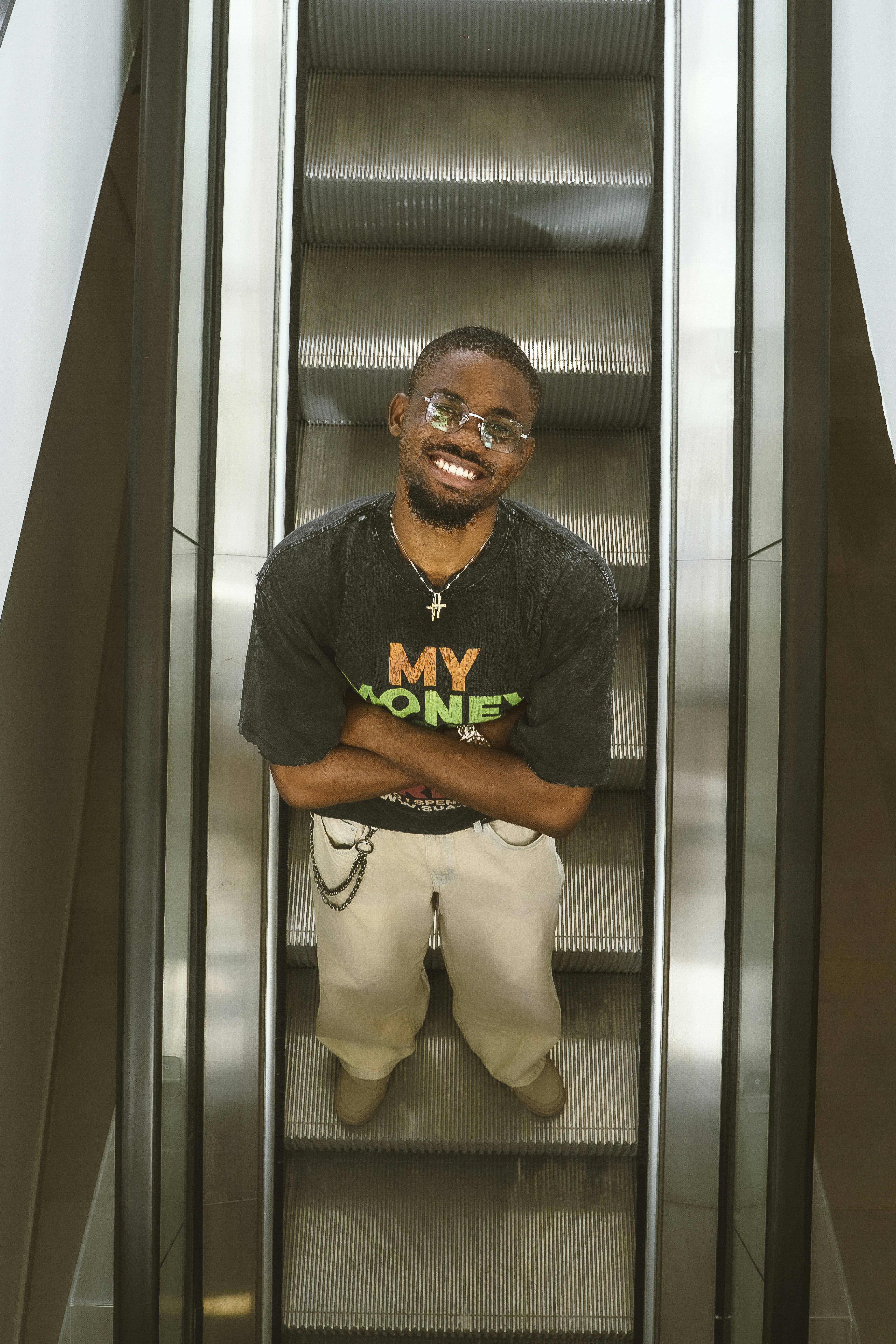 Grin on the Escalator: A Candid Portrait in Stainless Steel