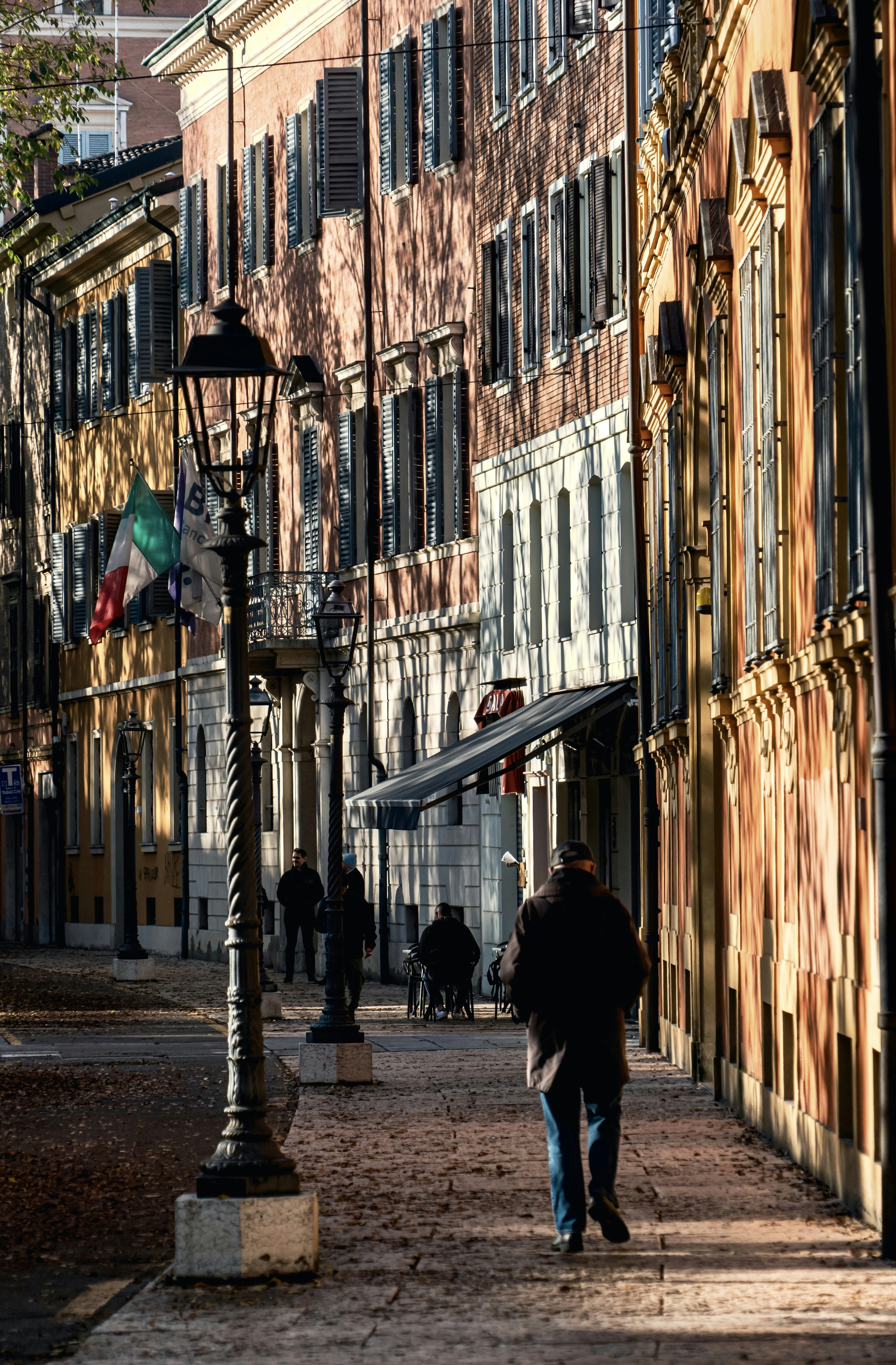 Golden Light on Brick and Iron: A Quiet Walk Along a European Street