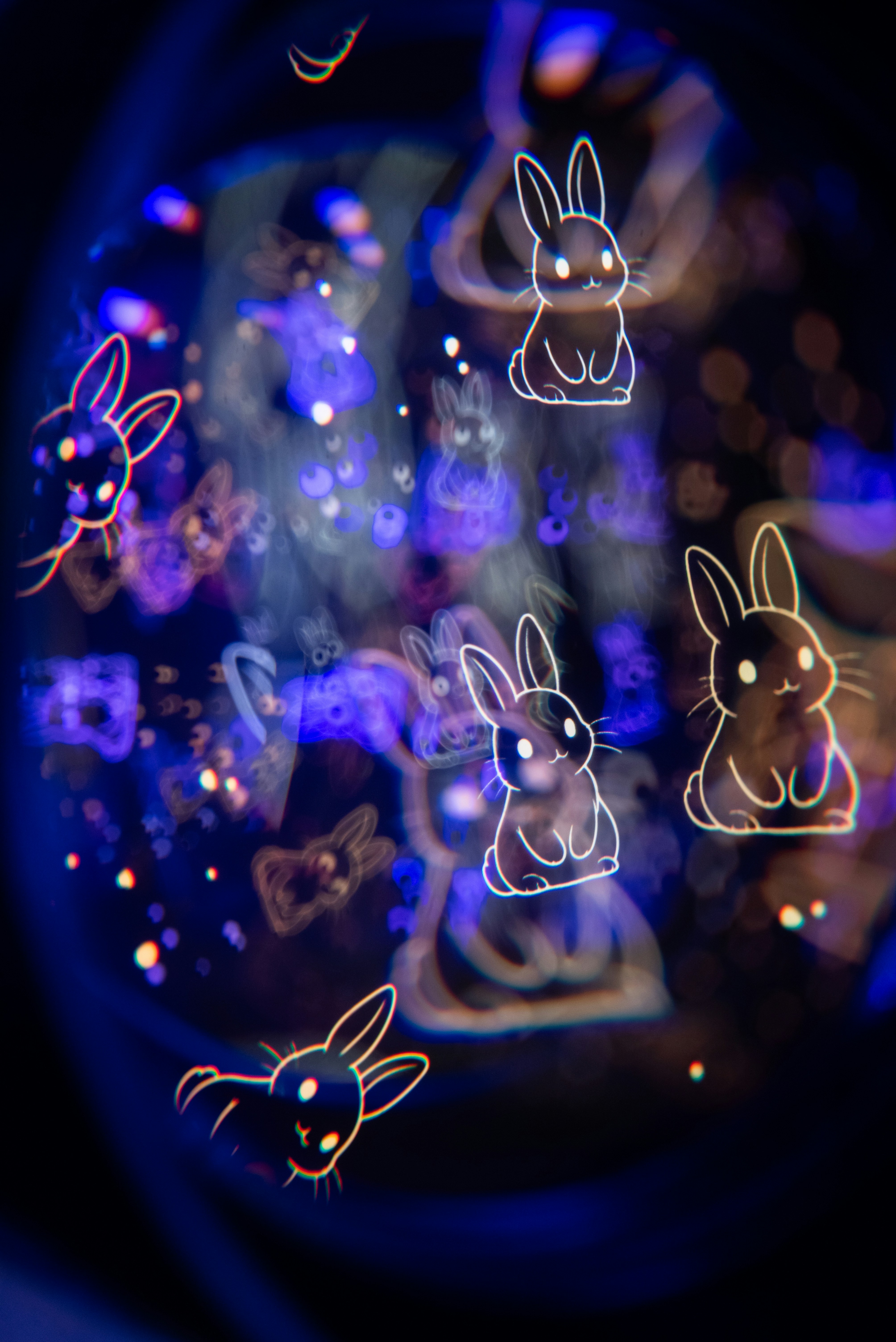 Neon Outline Parade: Bunny Silhouettes Drift in Blue Bokeh