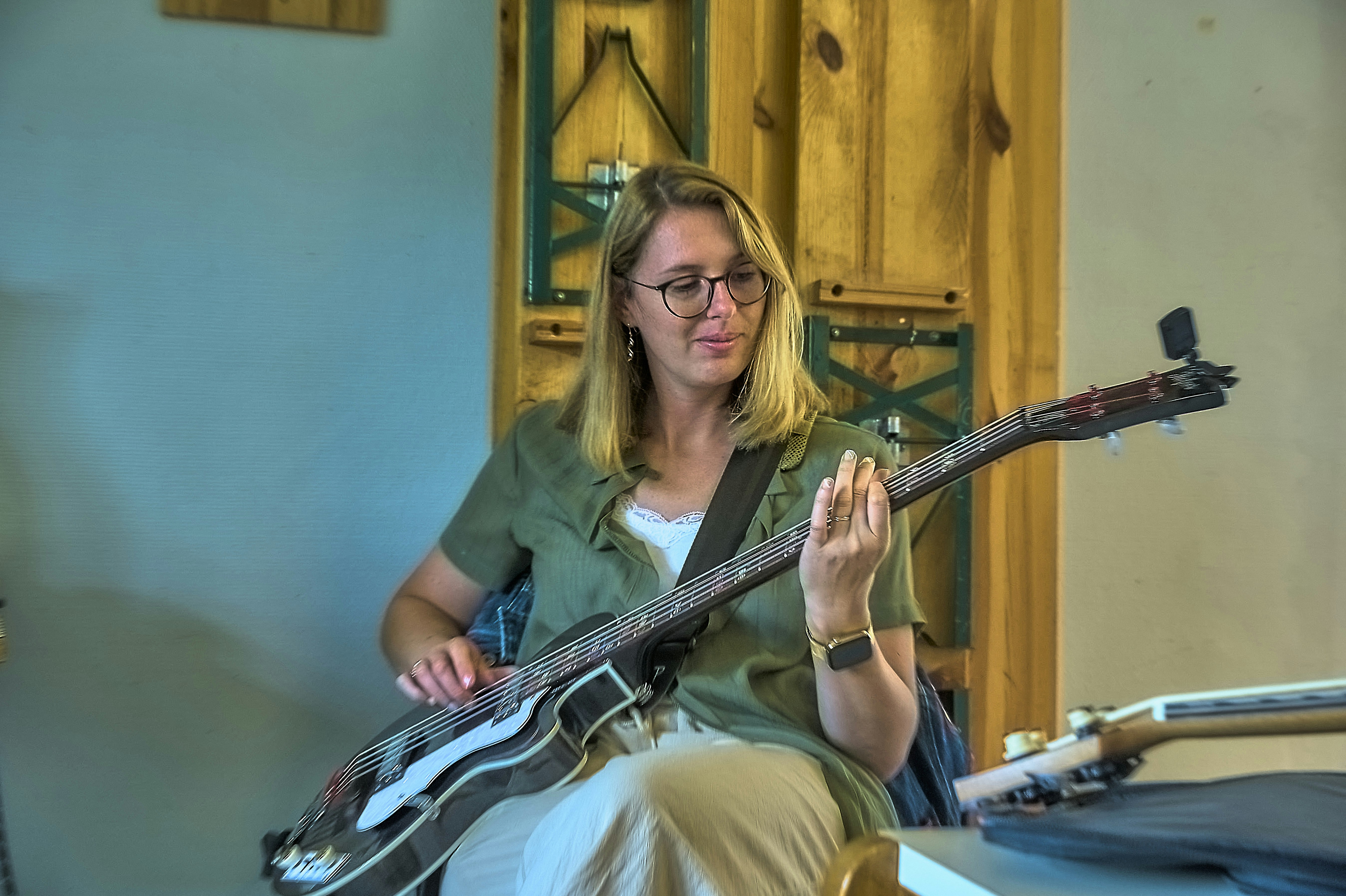 Timber-walled groove: a bassist finds focus in a sunlit studio