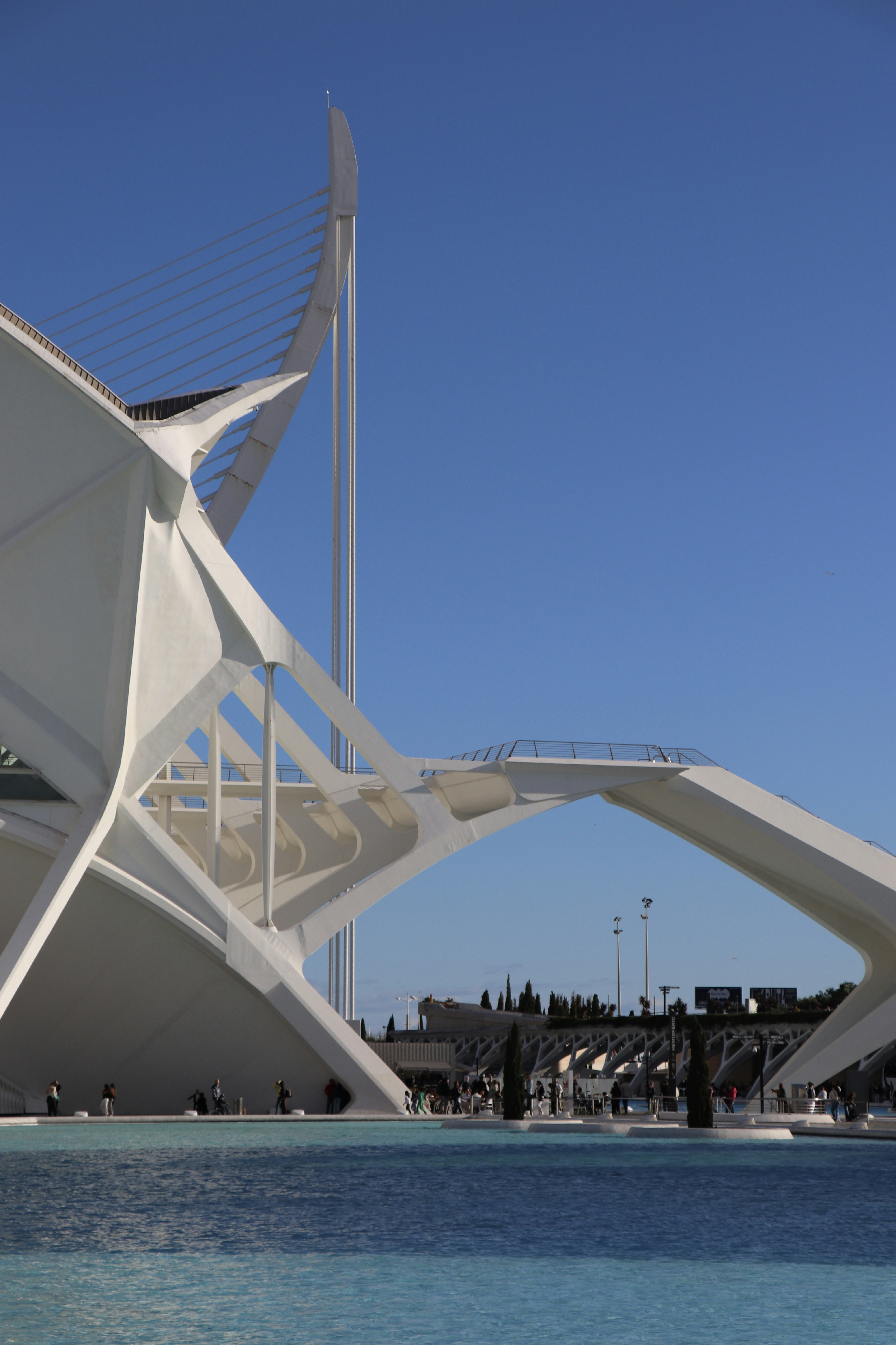 White Sails Against a Cerulean Sky: A Modern Arch of Steel and Sky