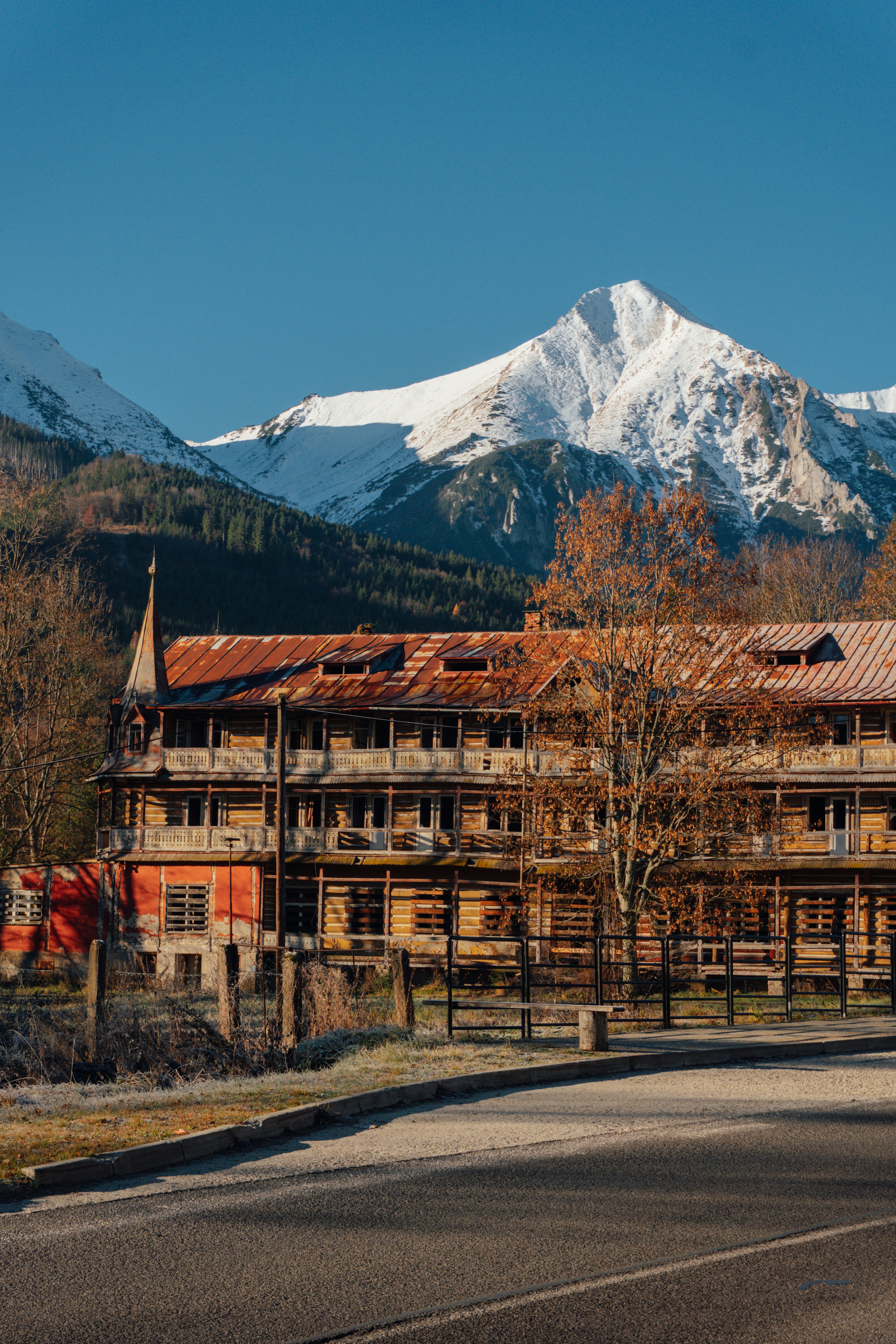 Rustic Alpine Lodge Framed by a Snowbound Summit