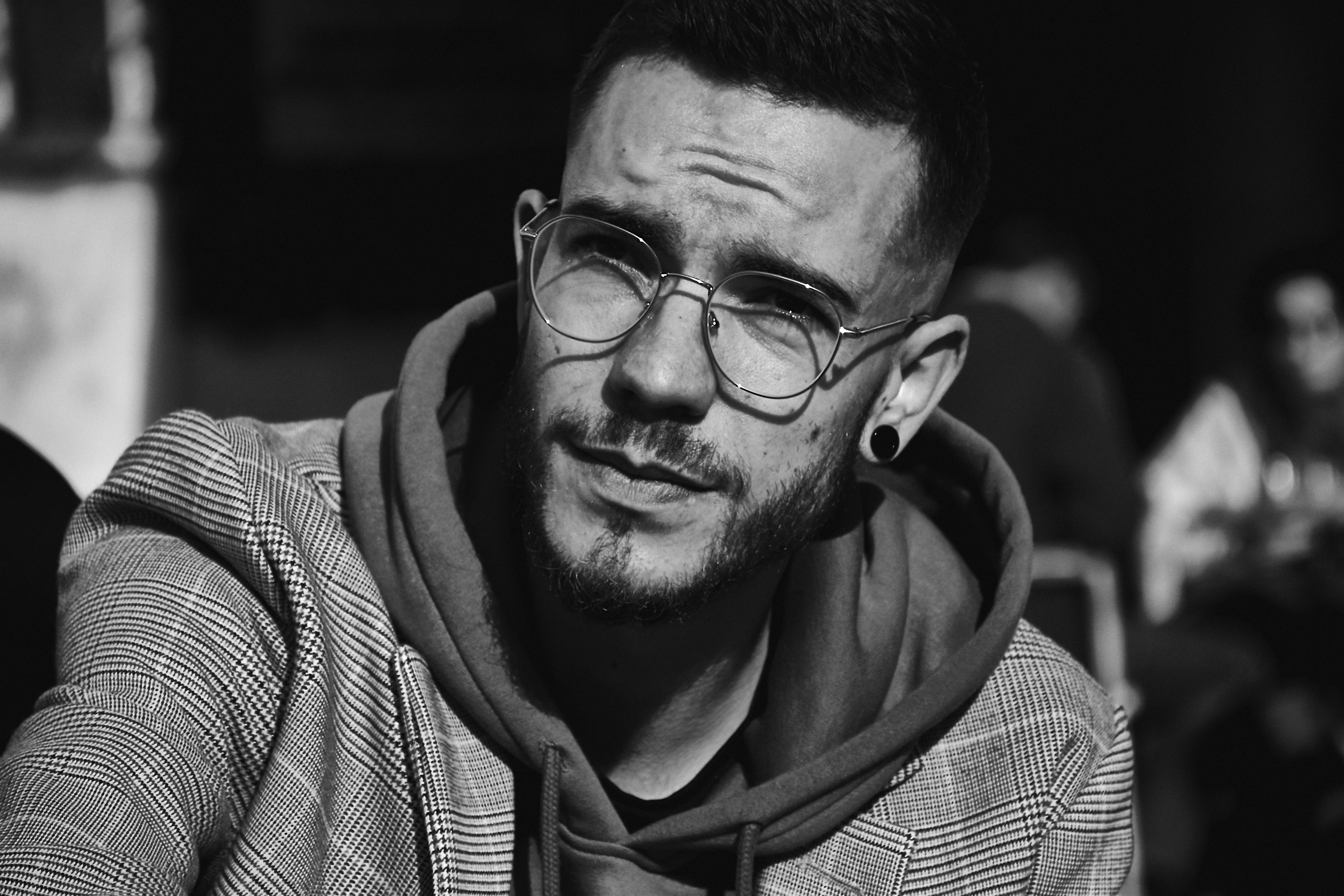 Grayscale Gaze: A Quiet Portrait in Hoodie and Blazer