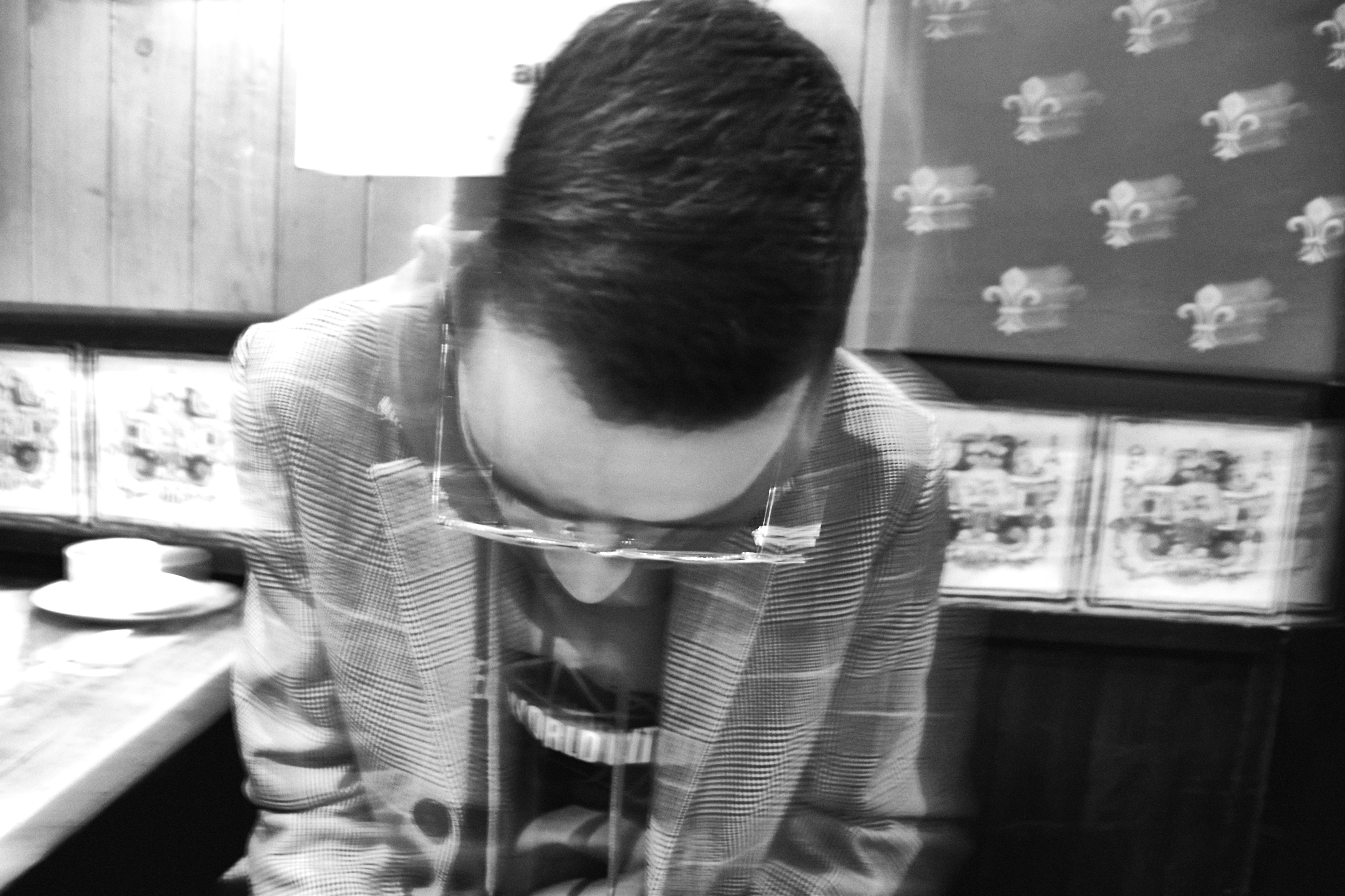 Gaze Beneath Glass: A Blazer-Clad Moment in Monochrome