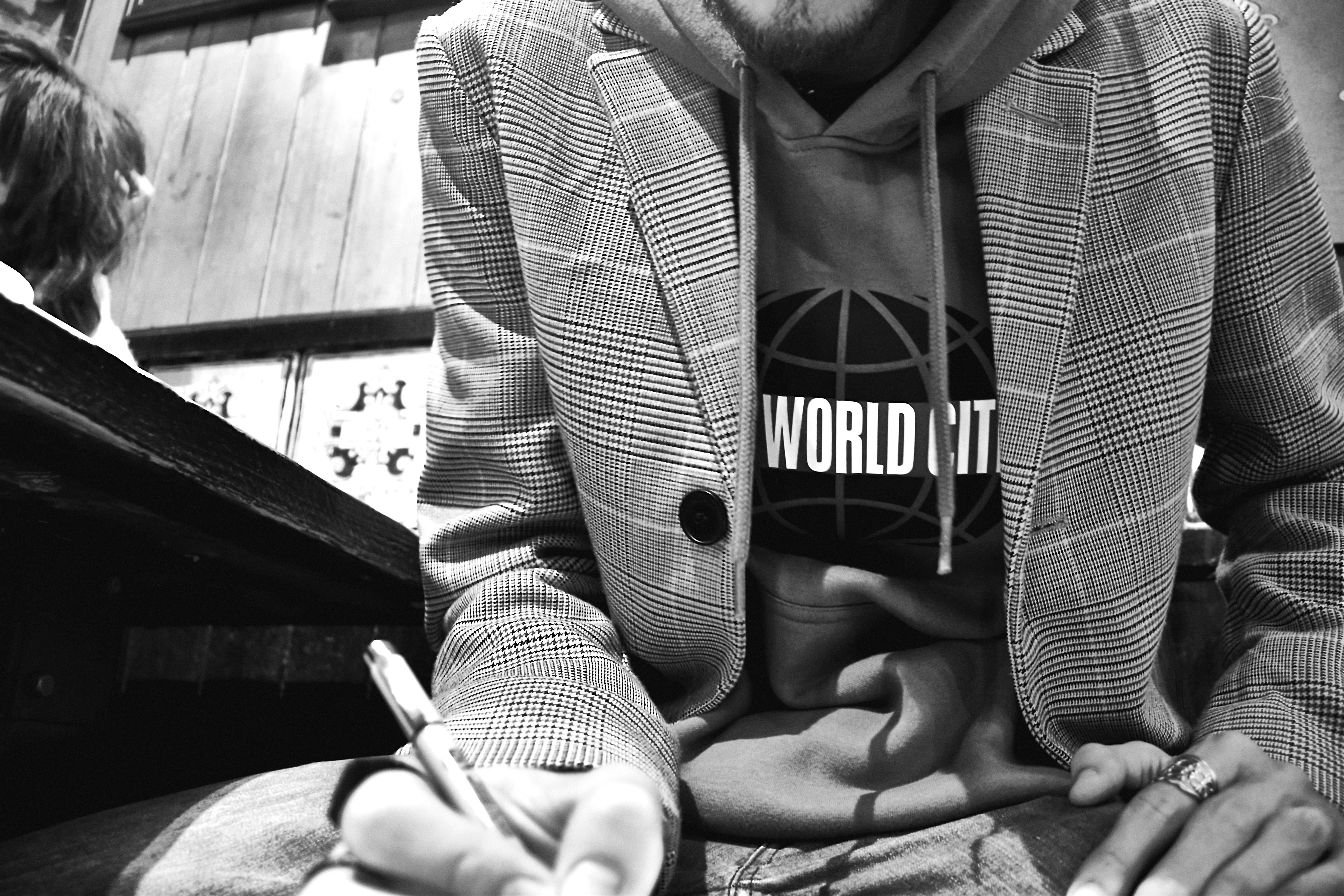 Pen and Plaid: Quiet Focus in a Monochrome Moment