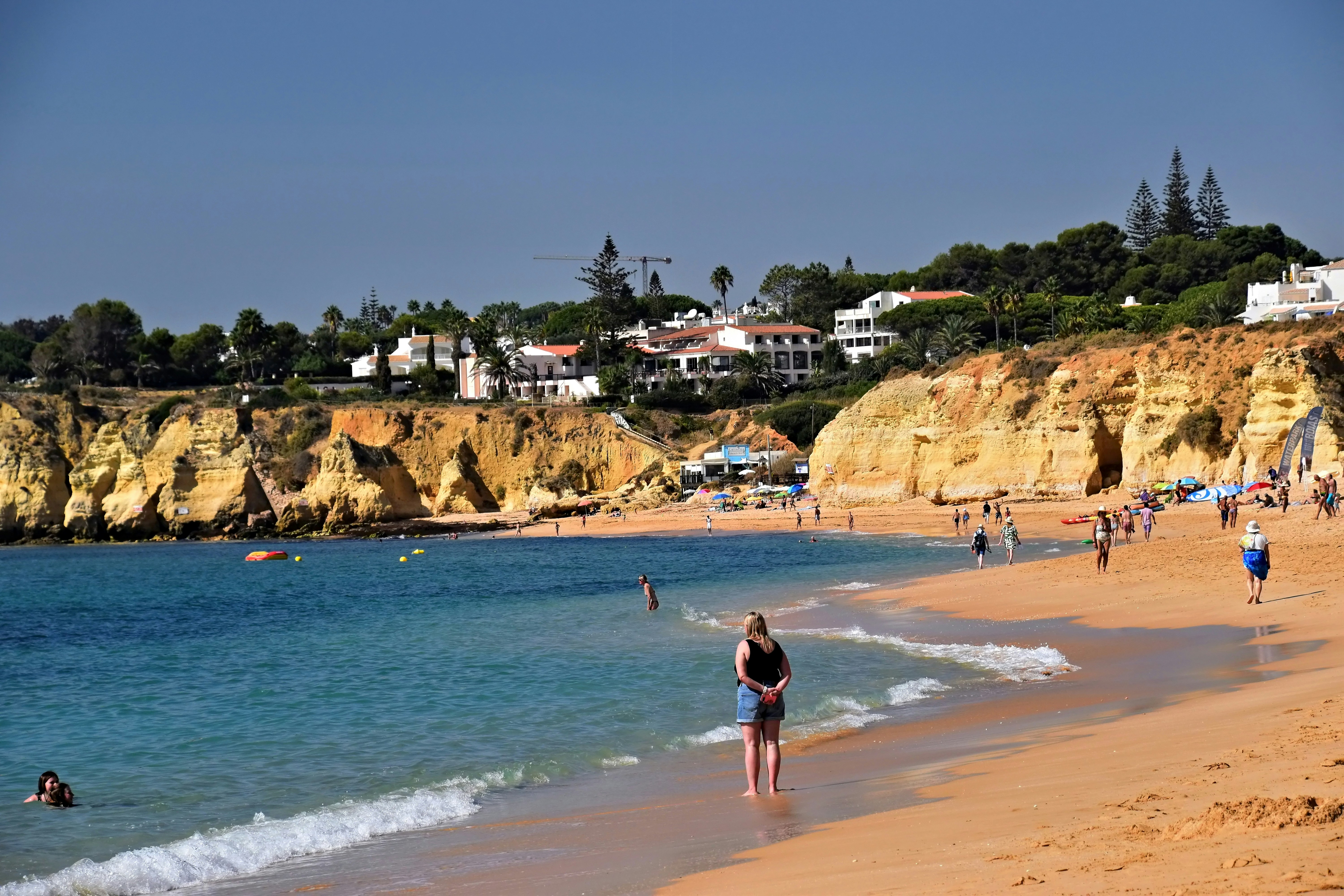 Cliffside Vista: A Quiet Beach Moment Beneath Coastal Homes