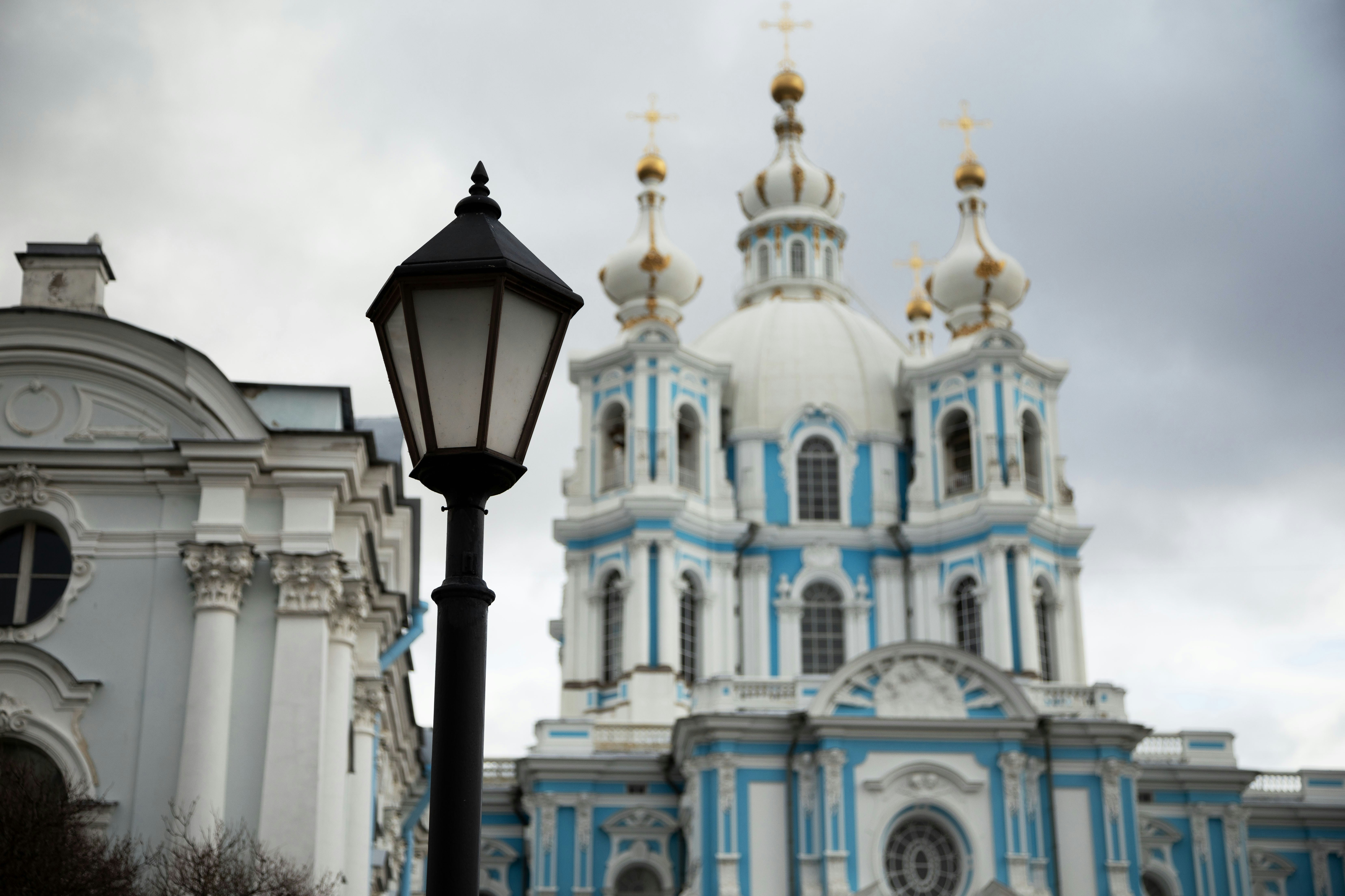 Lantern in Focus, Sky-Blue Cathedral Rising Behind