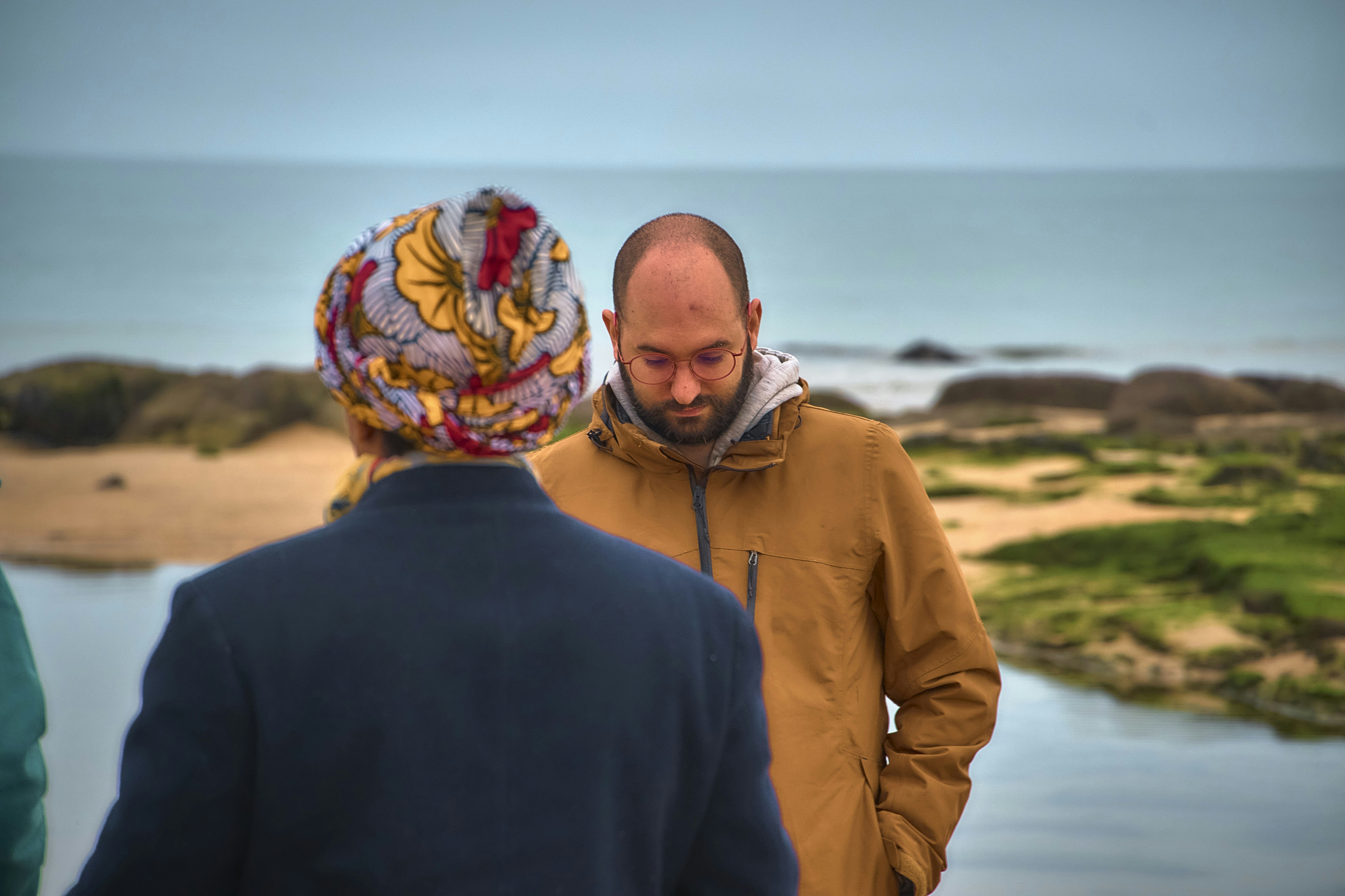 Tidebound Exchange: A Quiet Shoreline Conversation in Soft Focus