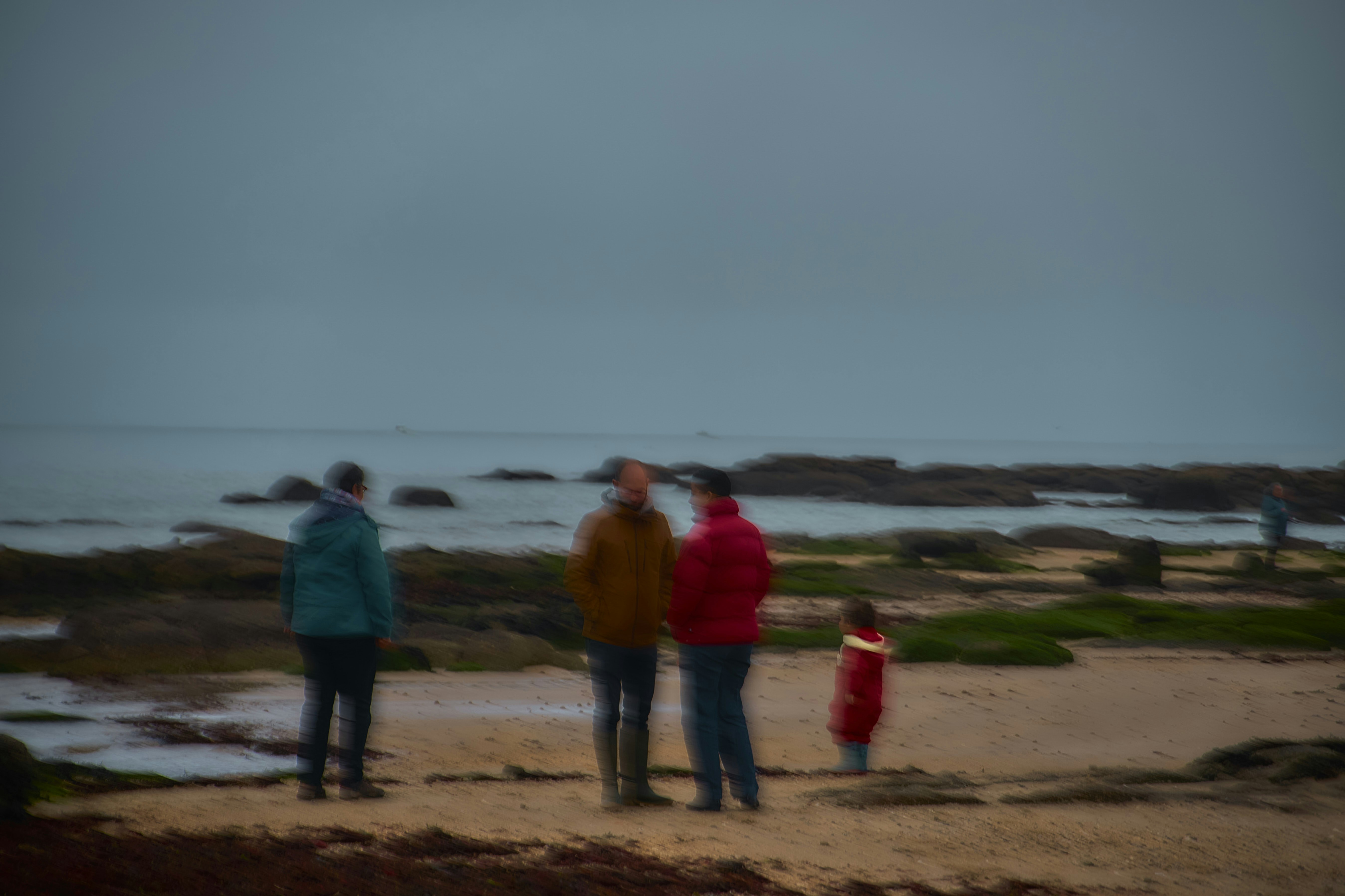Blurred Beach Assembly: A Quiet Moment by the Tide