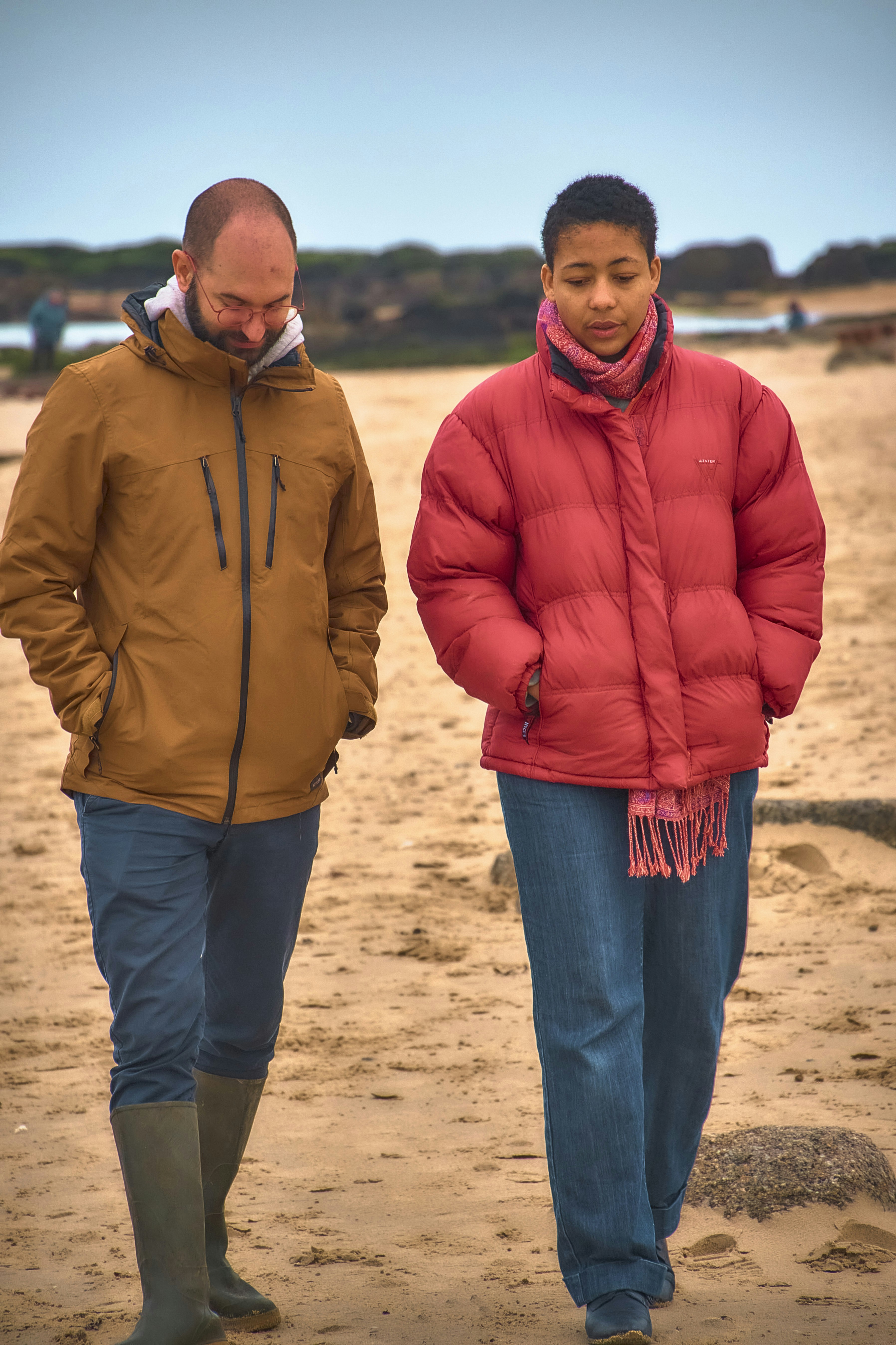 Cozy Jackets, Quiet Shoreline: A Beach Walk in Color